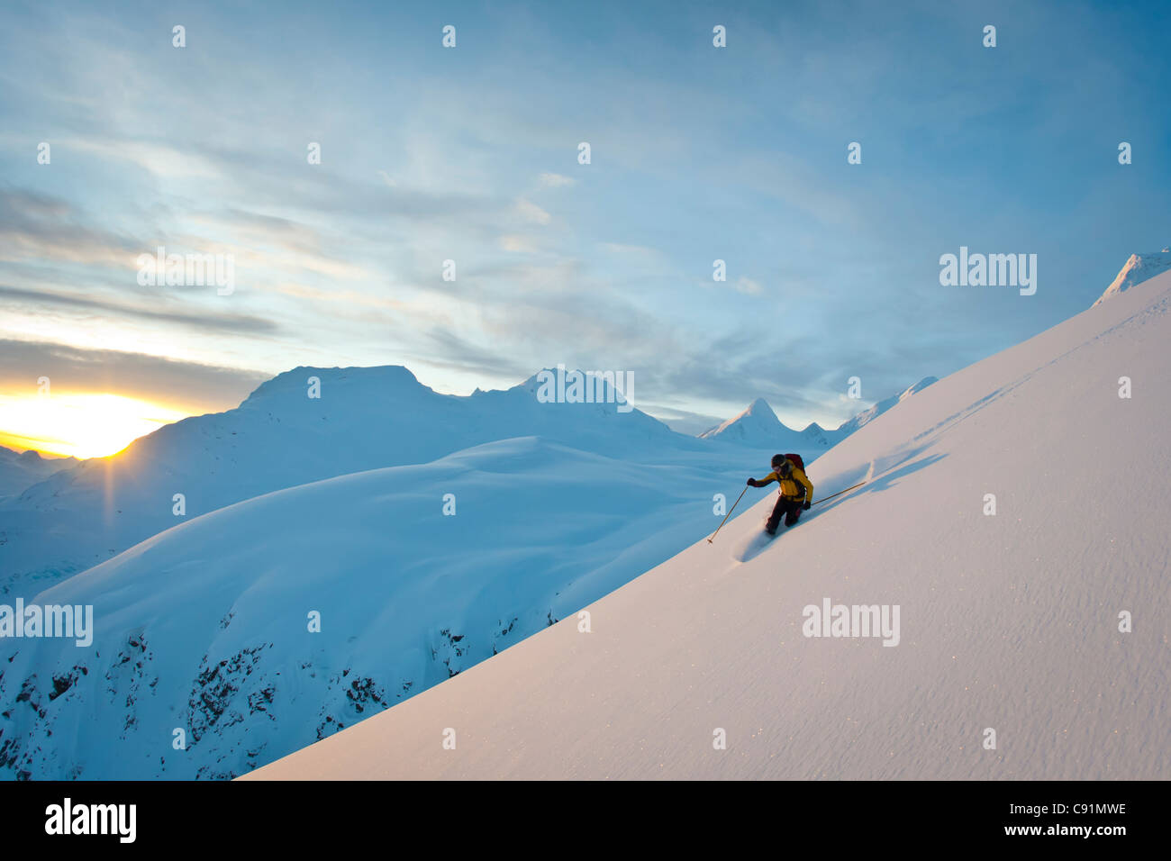 Skier skiing powder snow above Thompson Pass on Girls Mountain near ...