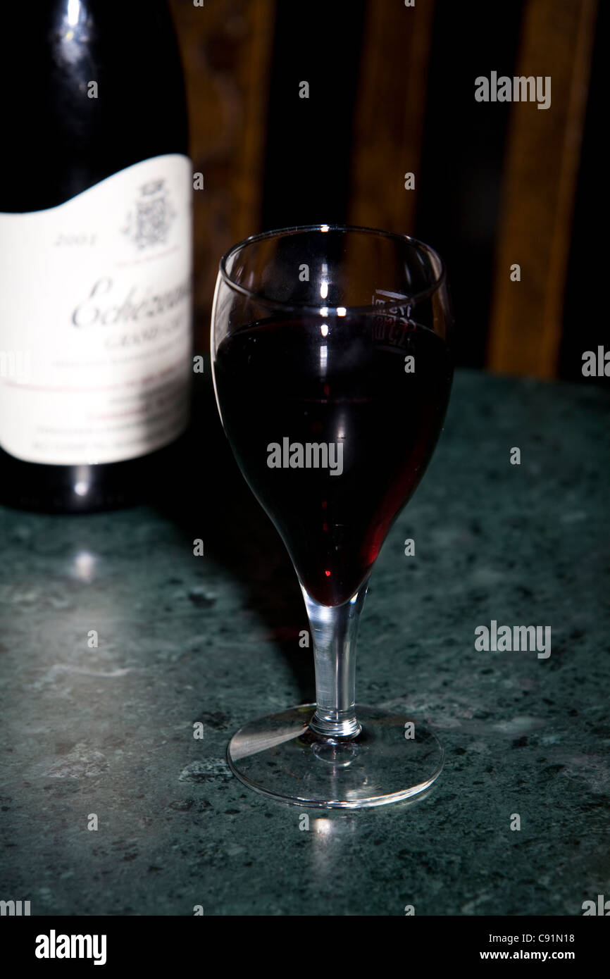 Glass of red wine on marble table Stock Photo - Alamy