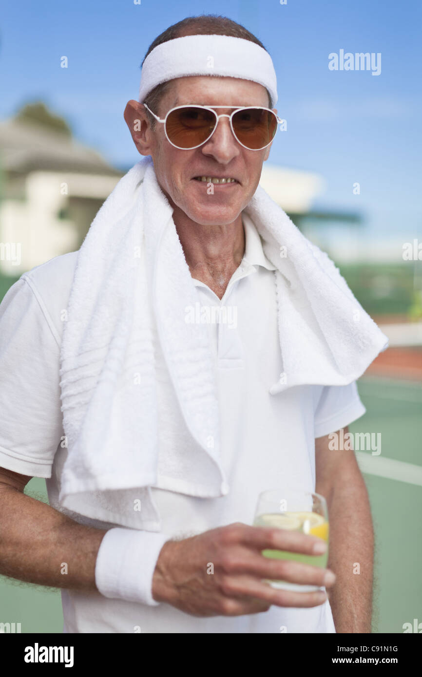 Older man drinking lemonade outdoors Stock Photo - Alamy