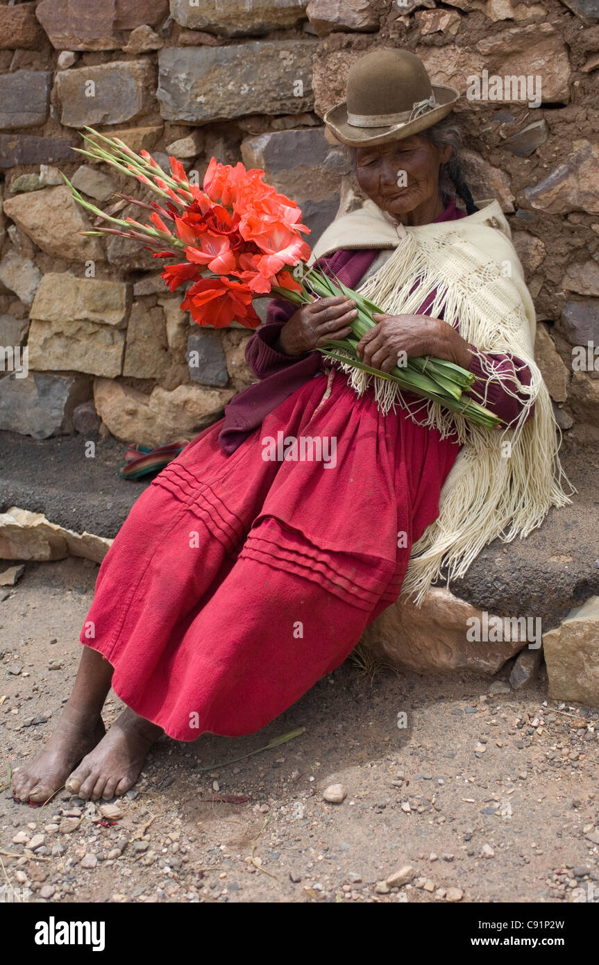 This old woman is selling flowers at the side of the road to Copacabana ...