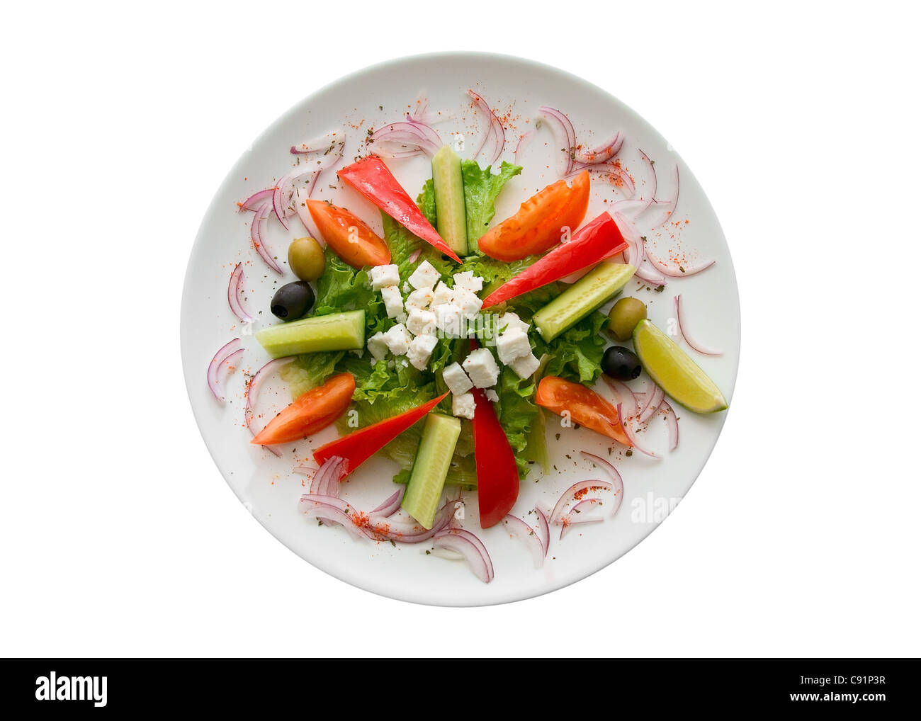 Appetizing salad in a plate on white background Stock Photo - Alamy