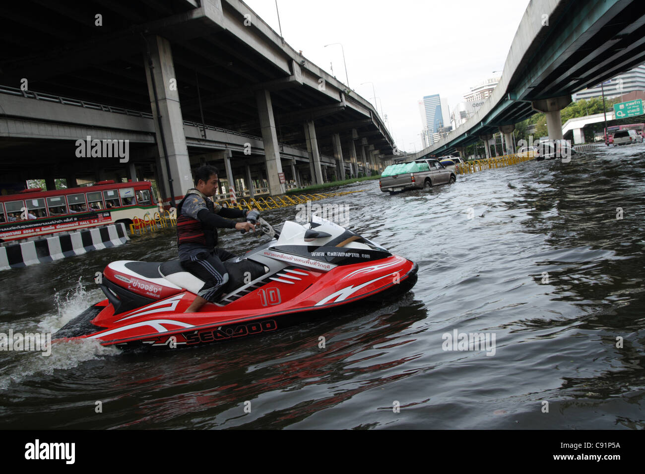 A man driving jet ski in floodstreet on November 8, 2011 in ladprao ...