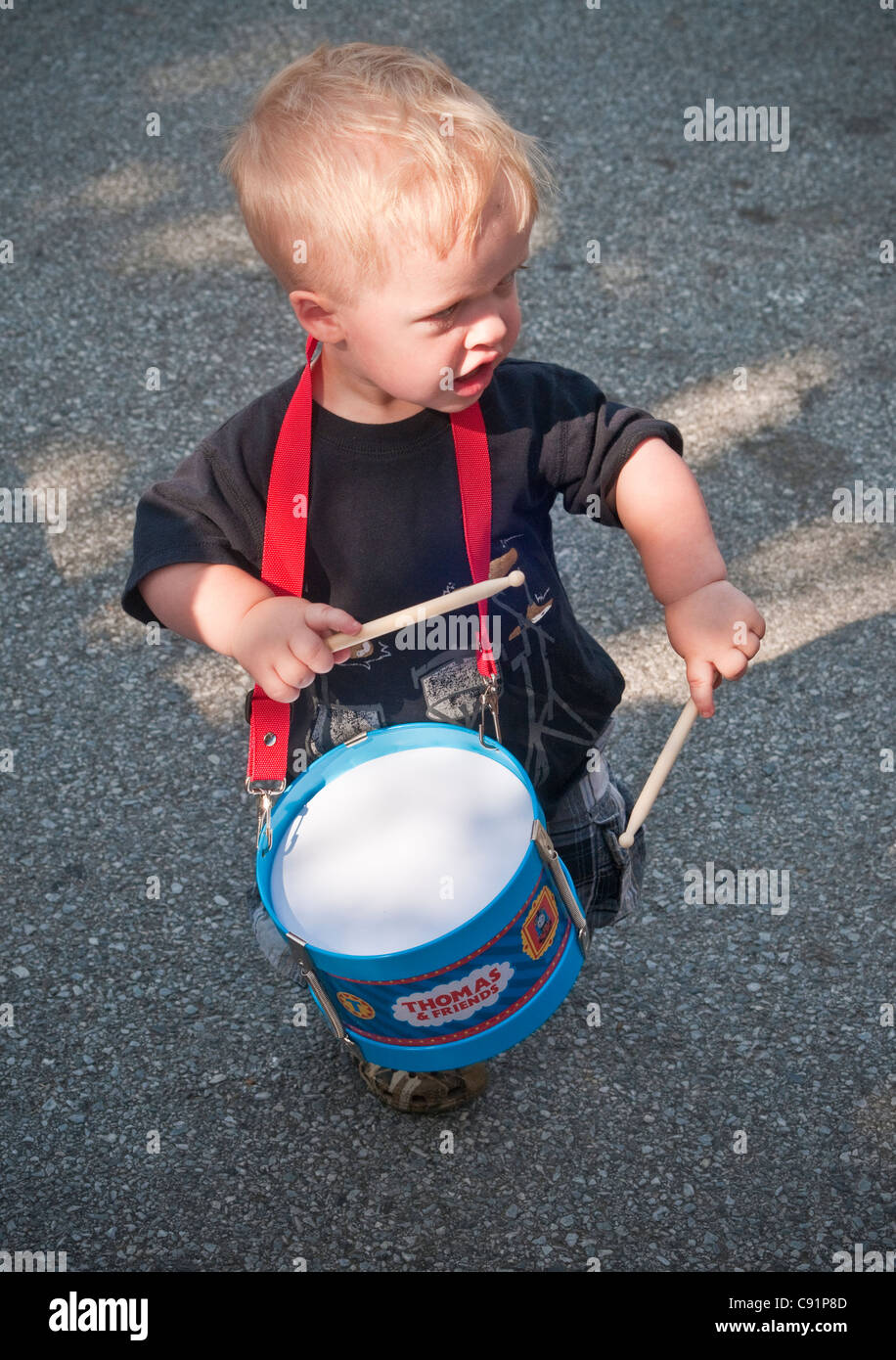 Small town, suburban, patriotic holiday parade celebrations. Small boy ...