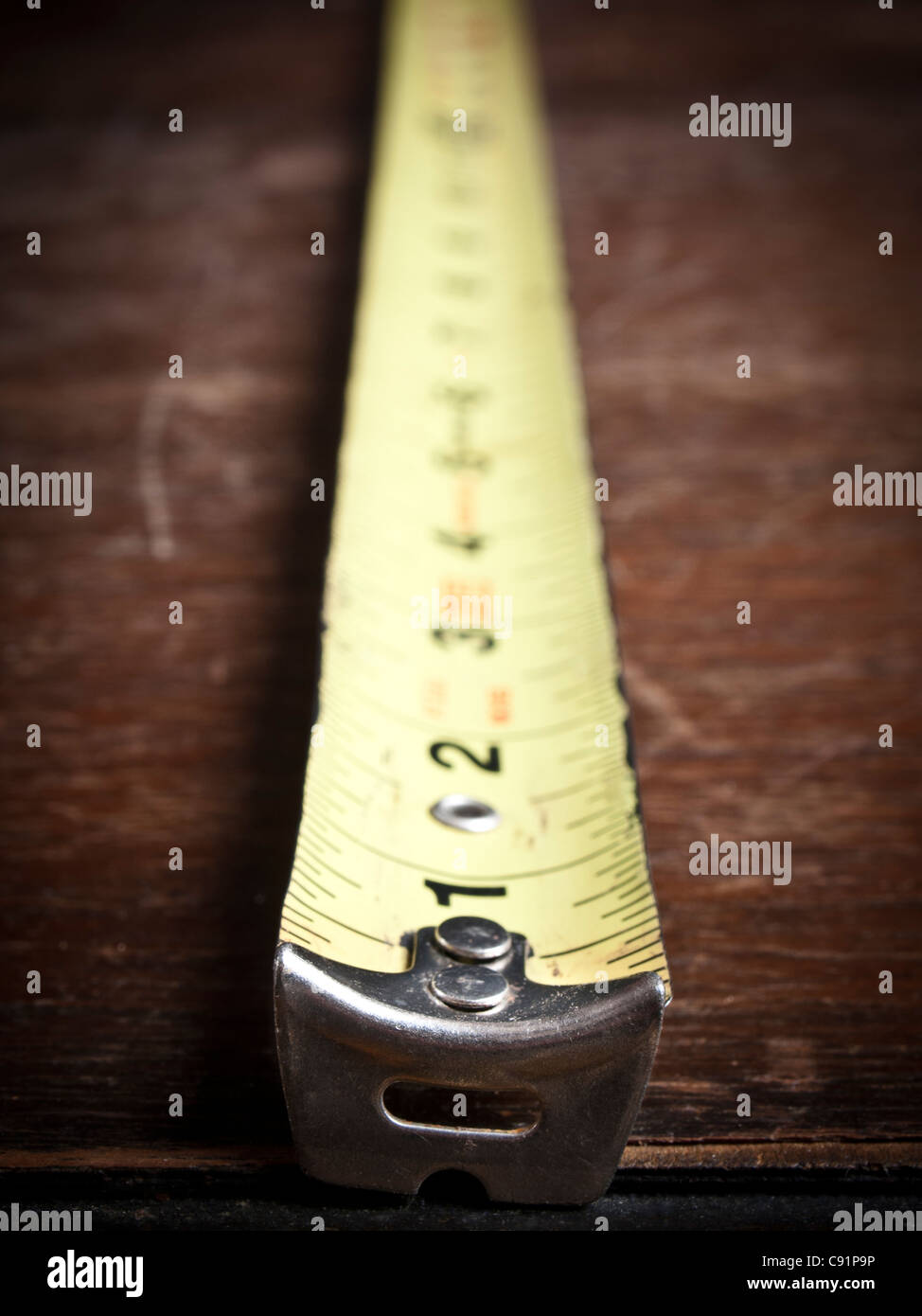 Old tape measure on an old table Stock Photo - Alamy