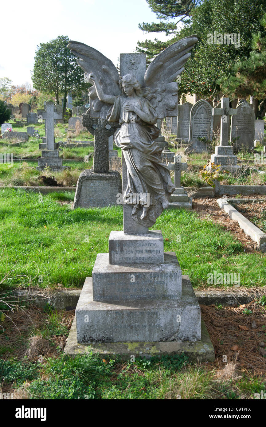 A carved stone angel as a gravestone Stock Photo - Alamy