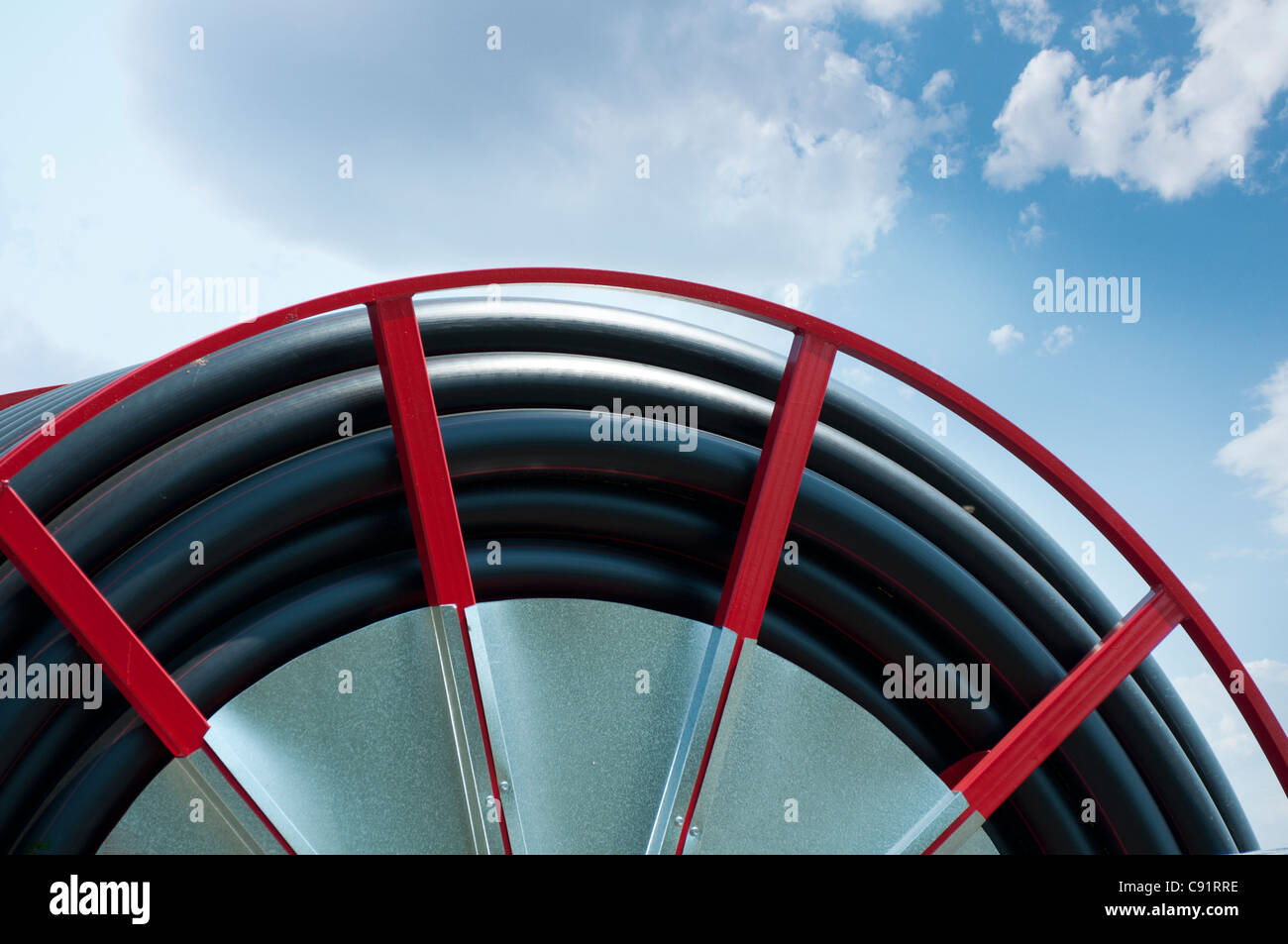 Agricultural hoses for irrigation rolled up Stock Photo - Alamy