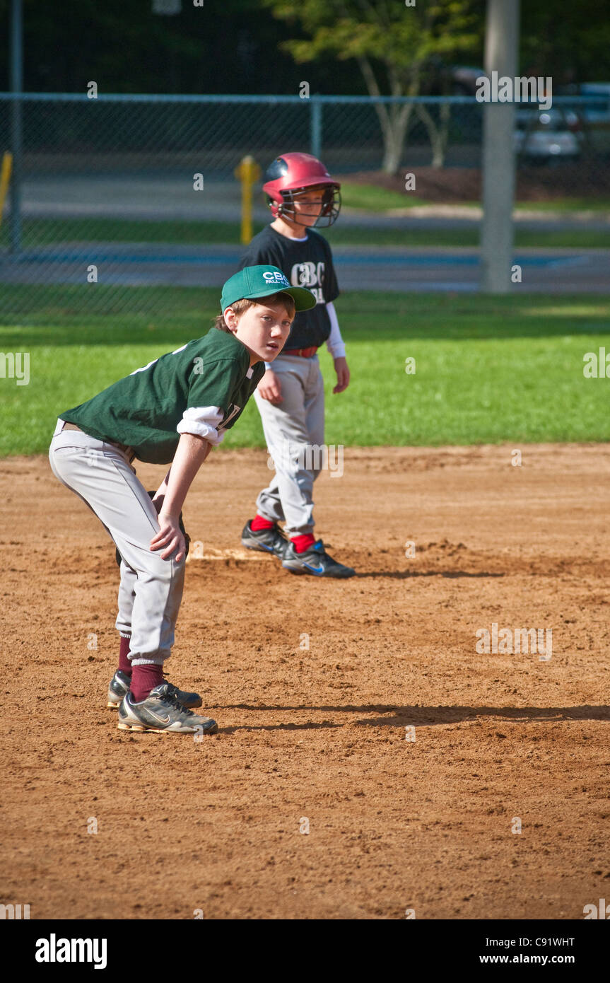Youth baseball player on second base Stock Photo - Alamy