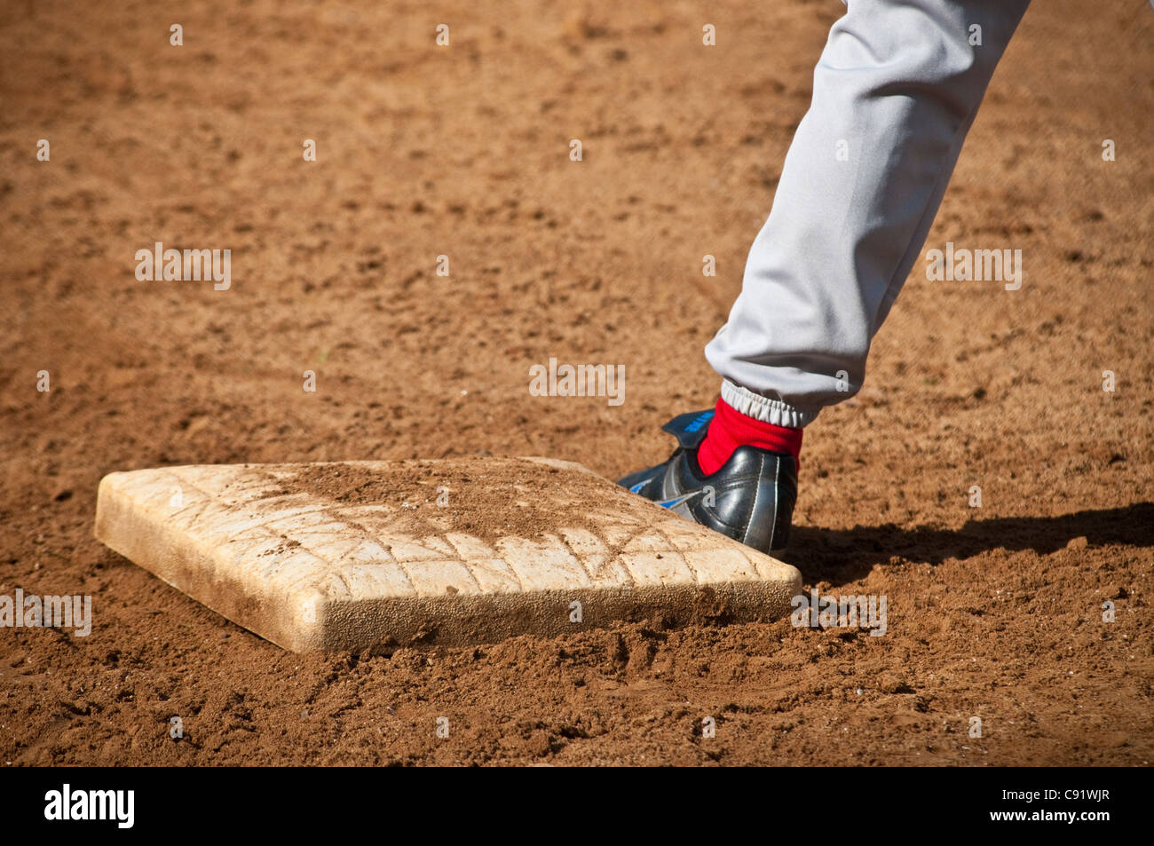 Runner on base Stock Photo - Alamy