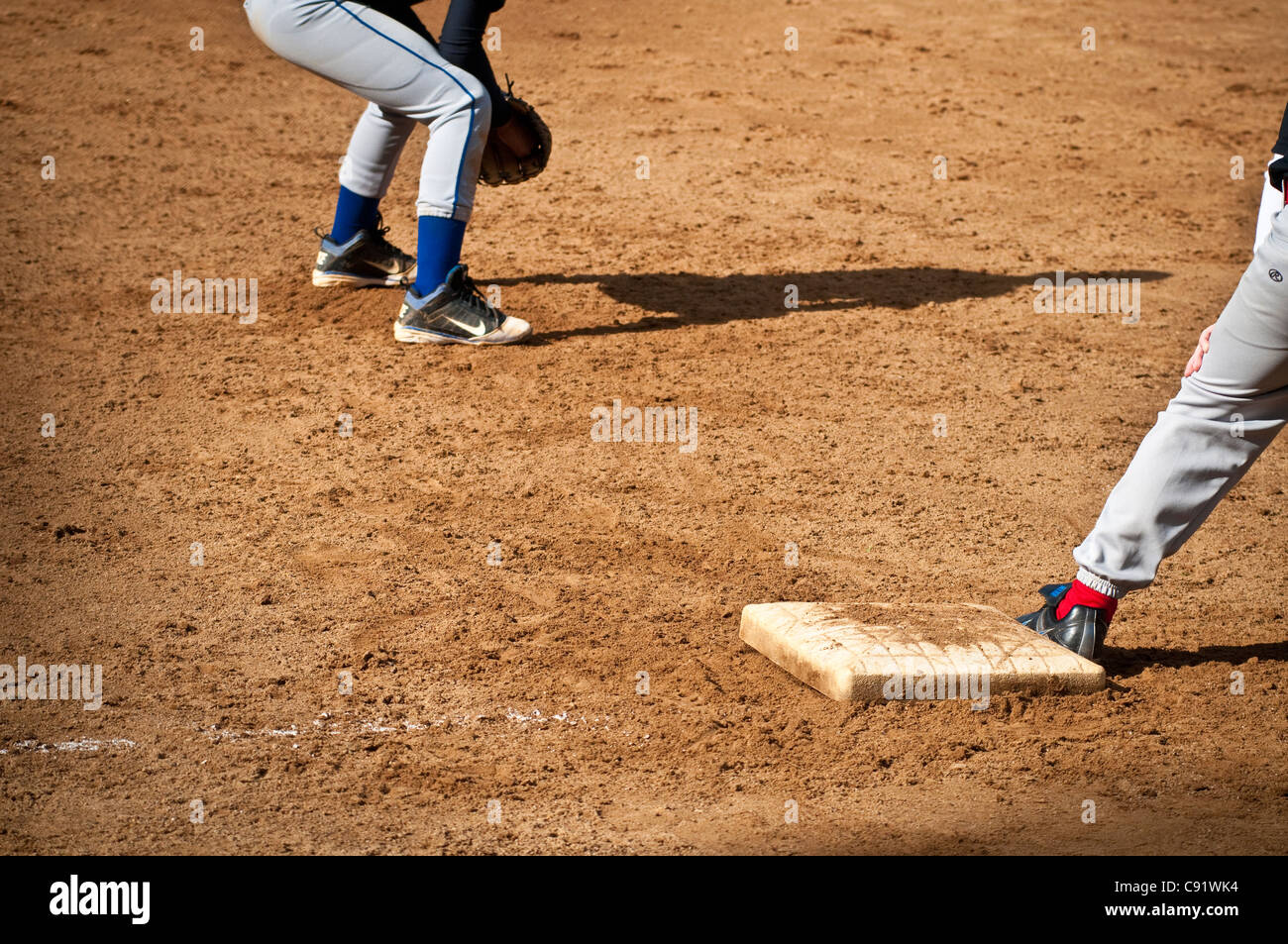 Runner on base Stock Photo - Alamy