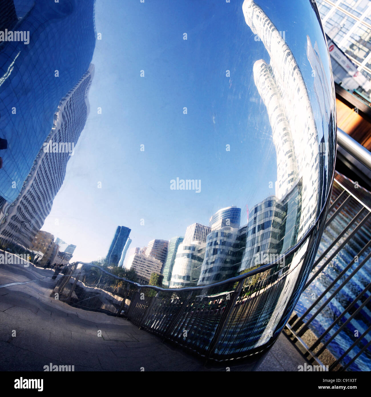 Modern business quarter reflected in a distorted mirror Stock Photo - Alamy