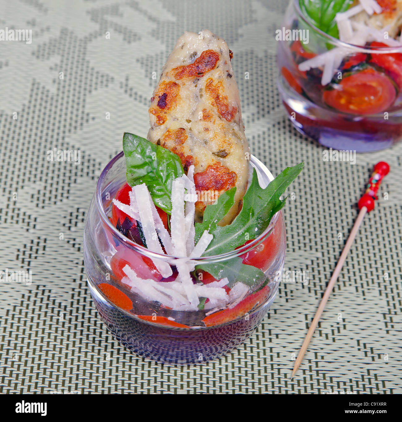 Quark and rocket gnocchi as an aperitif in the amuse-bouche-glass Stock ...