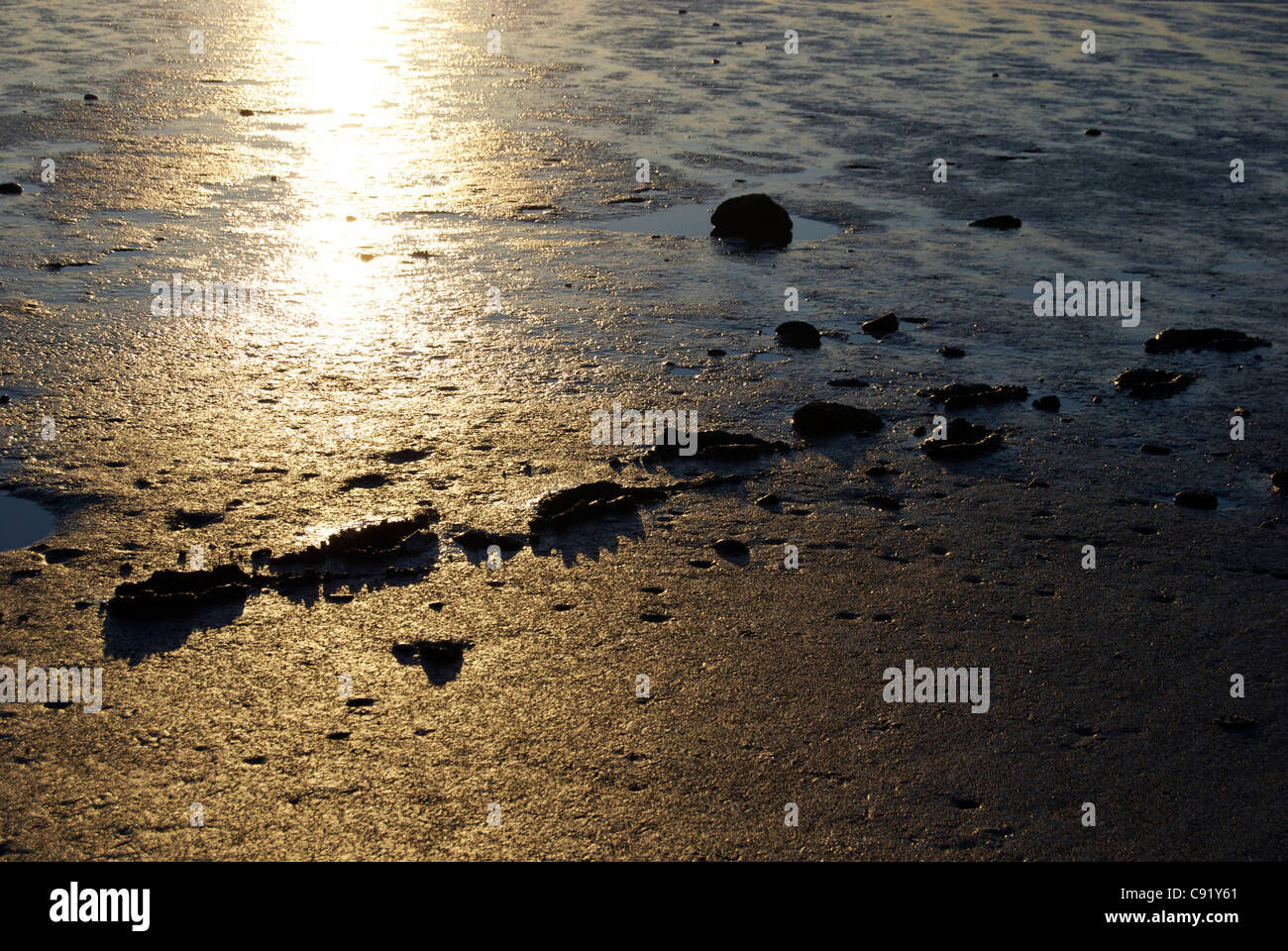 Sun shining on footprints on a beach on the Wirral Stock Photo - Alamy