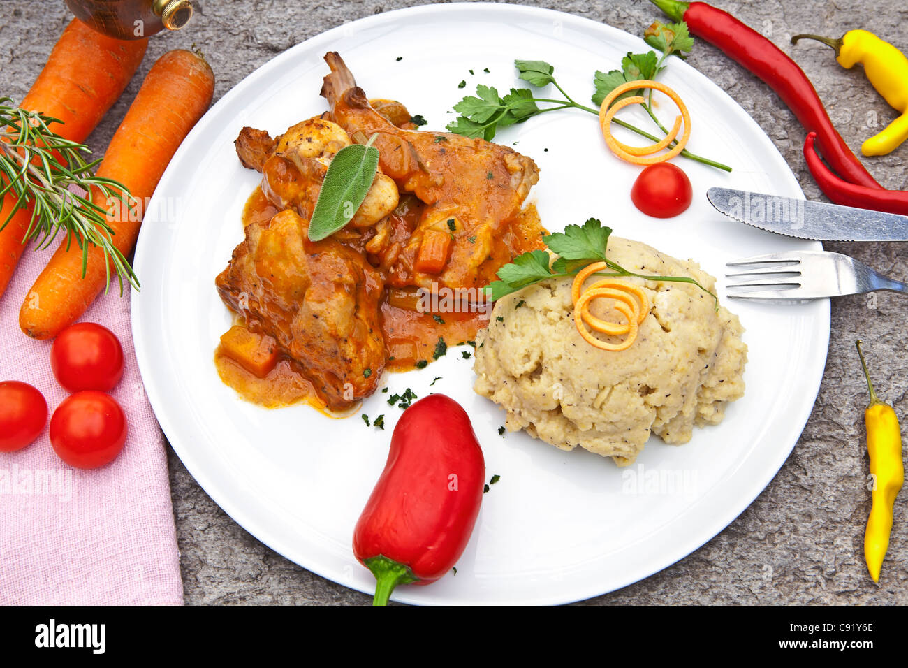 Rabbit with polenta, served on the terrace of a Ticino Grotto Stock ...