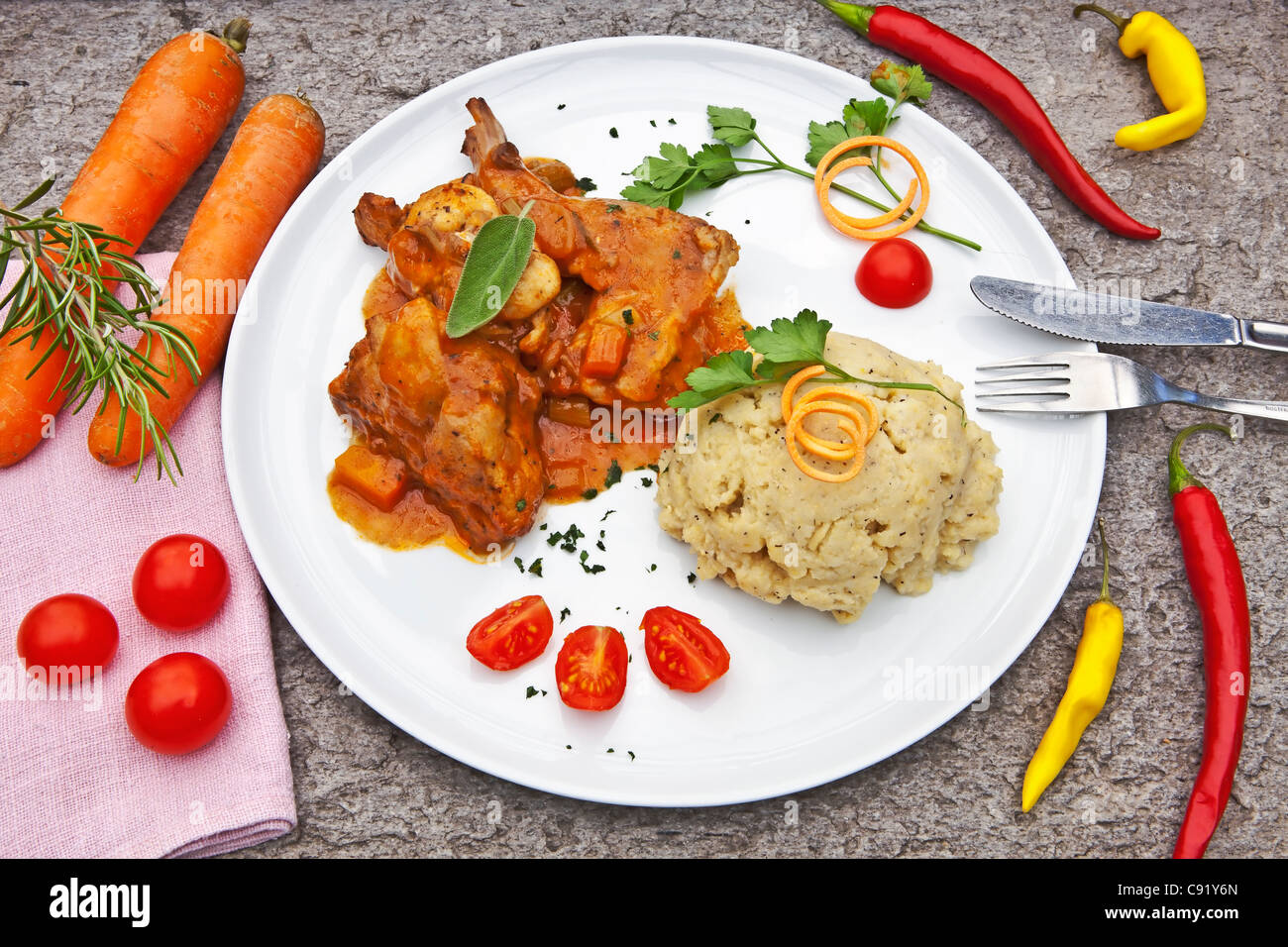 Rabbit with polenta, served on the terrace of a Ticino Grotto Stock ...