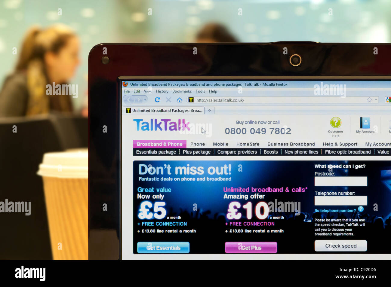 The TalkTalk website shot in a coffee shop environment (Editorial use ...