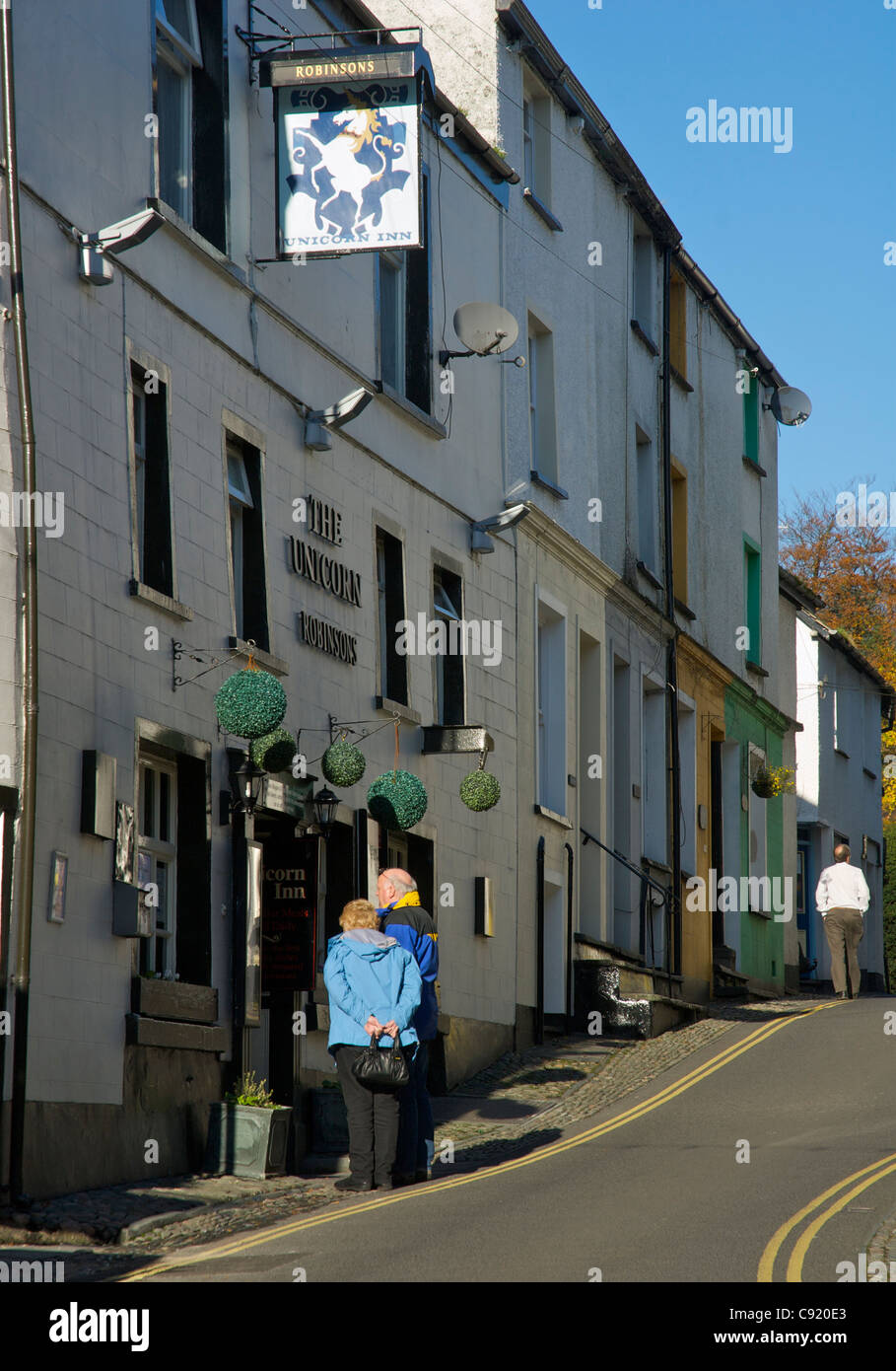 Two people perusing the menu of the Unicorn pub in Ambleside, Lake ...