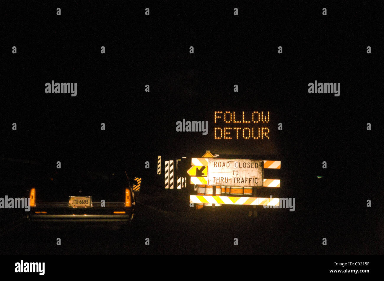 Follow detour road closed sign Stock Photo - Alamy