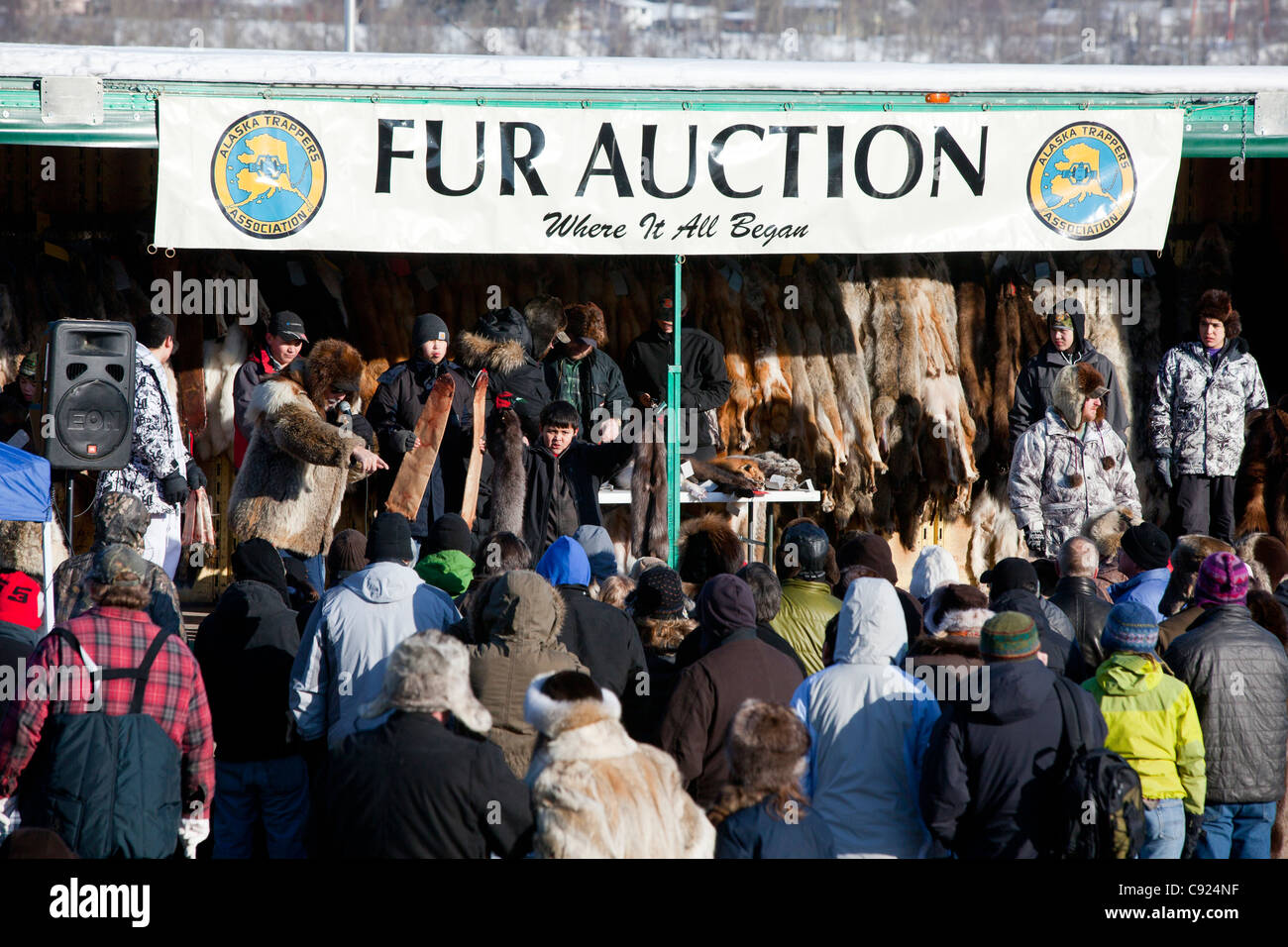 Crowds at the fur auction during 2011 Fur Rondy festival in downtown ...