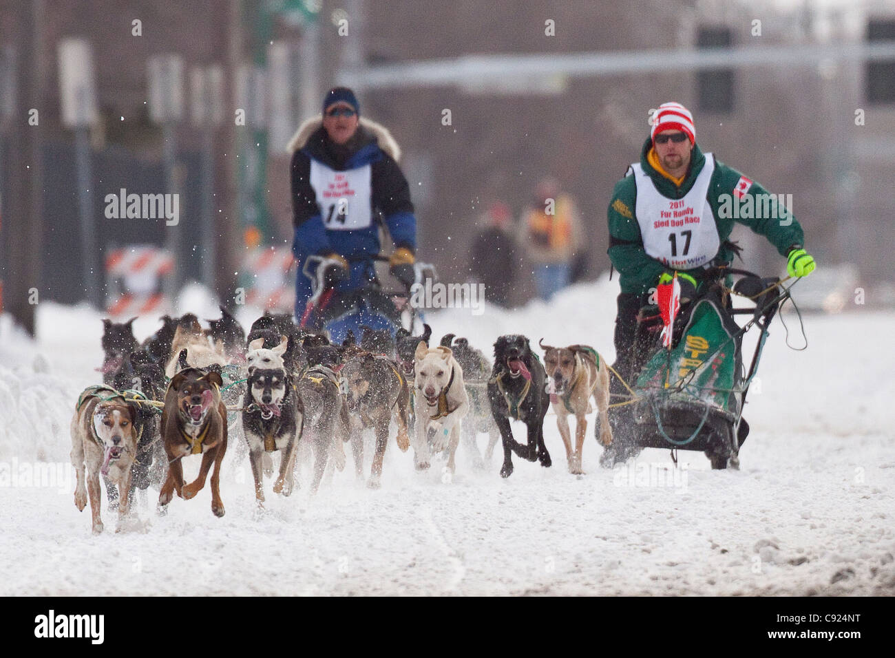 Blayne Streeper passes musher number 14 during the Fur Rondy World ...