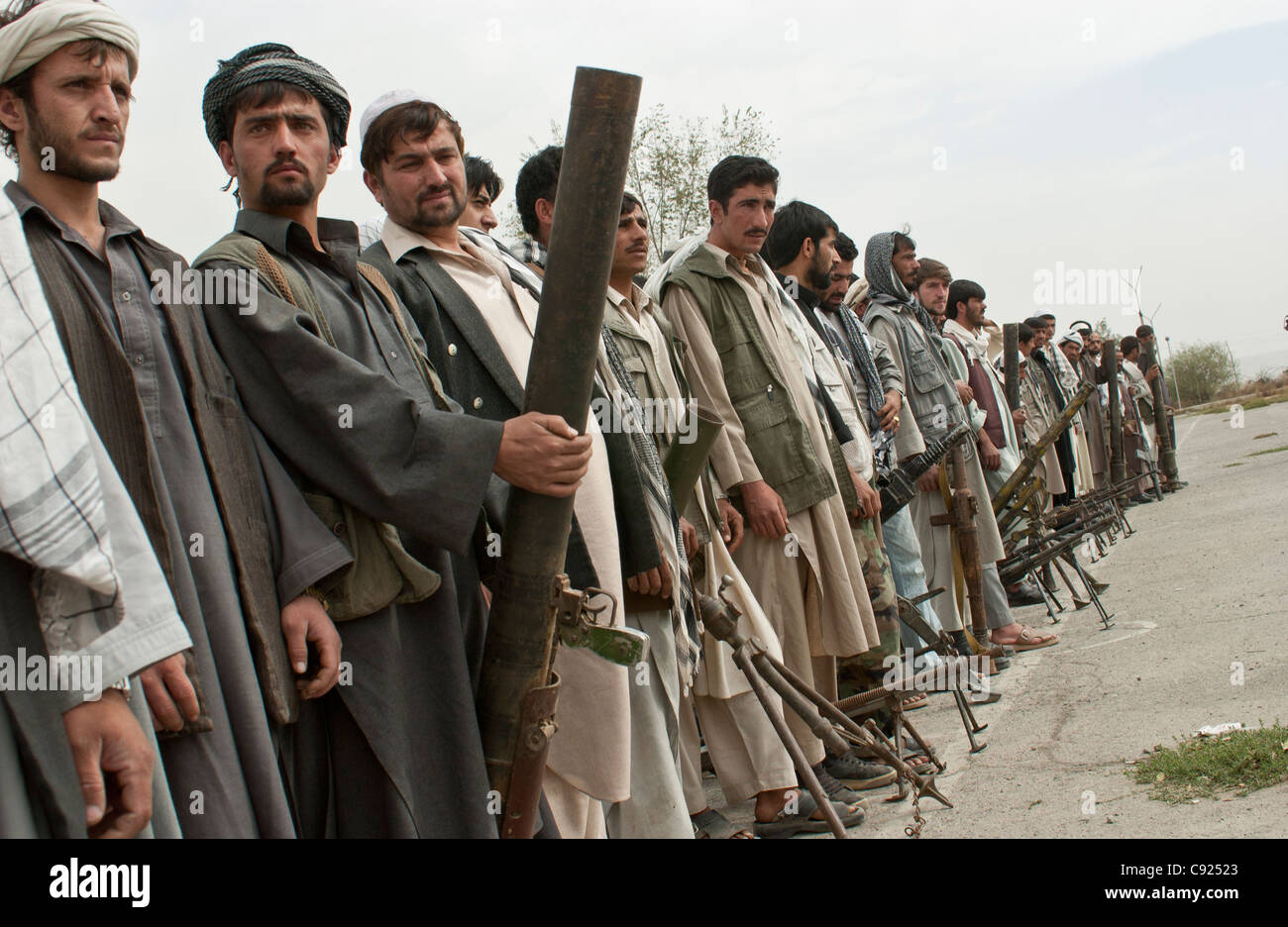 Former militia fighters gather at an army base, as part of a UN DDR ...