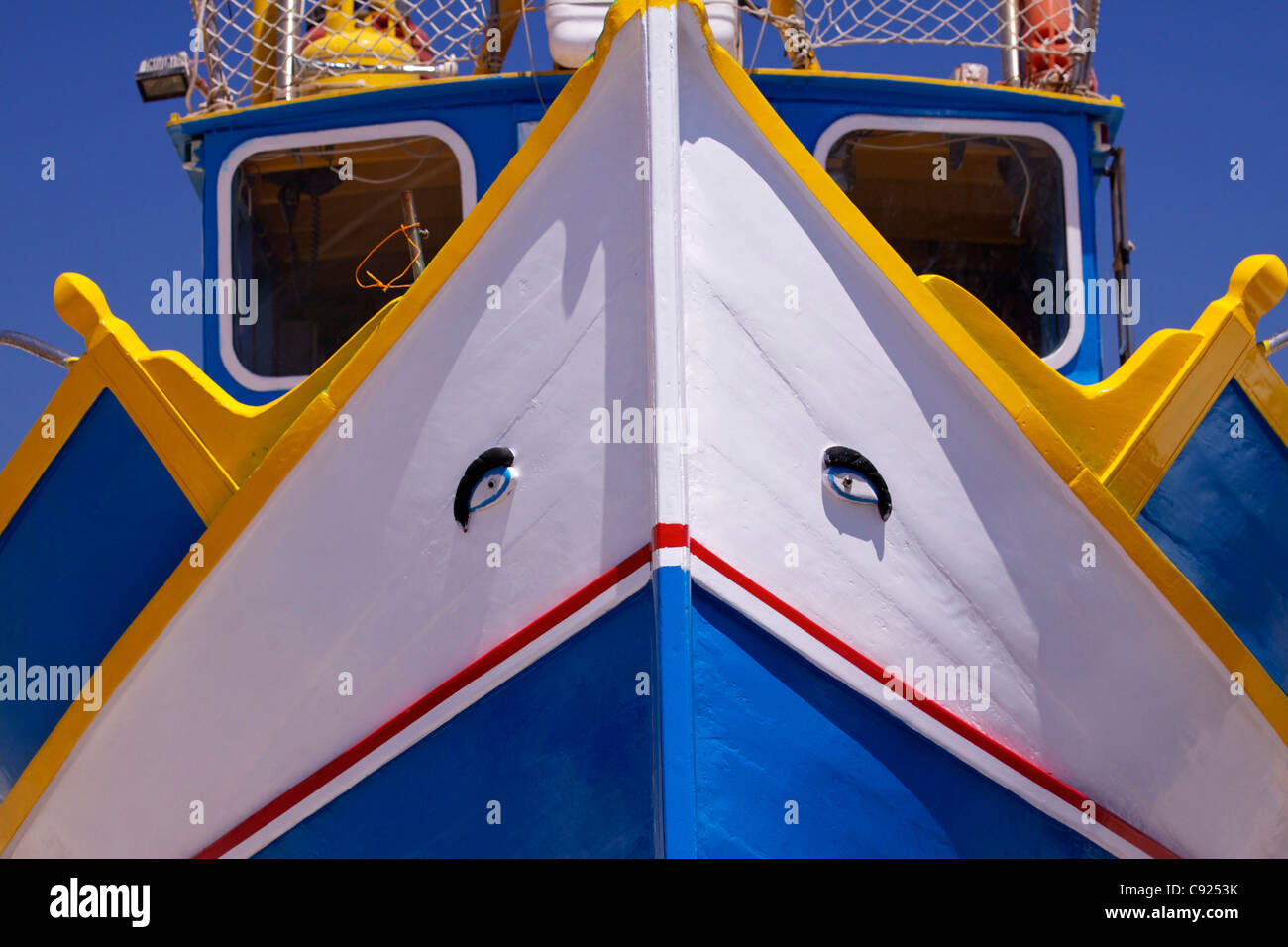 A Luzzu a traditional Maltese fishing boat painted in blue yellow and ...