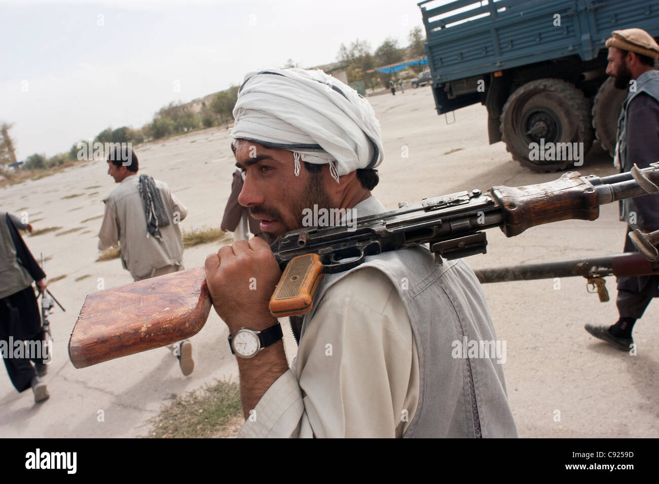 Former militia fighters arrive at an army base, as part of a UN DDR ...