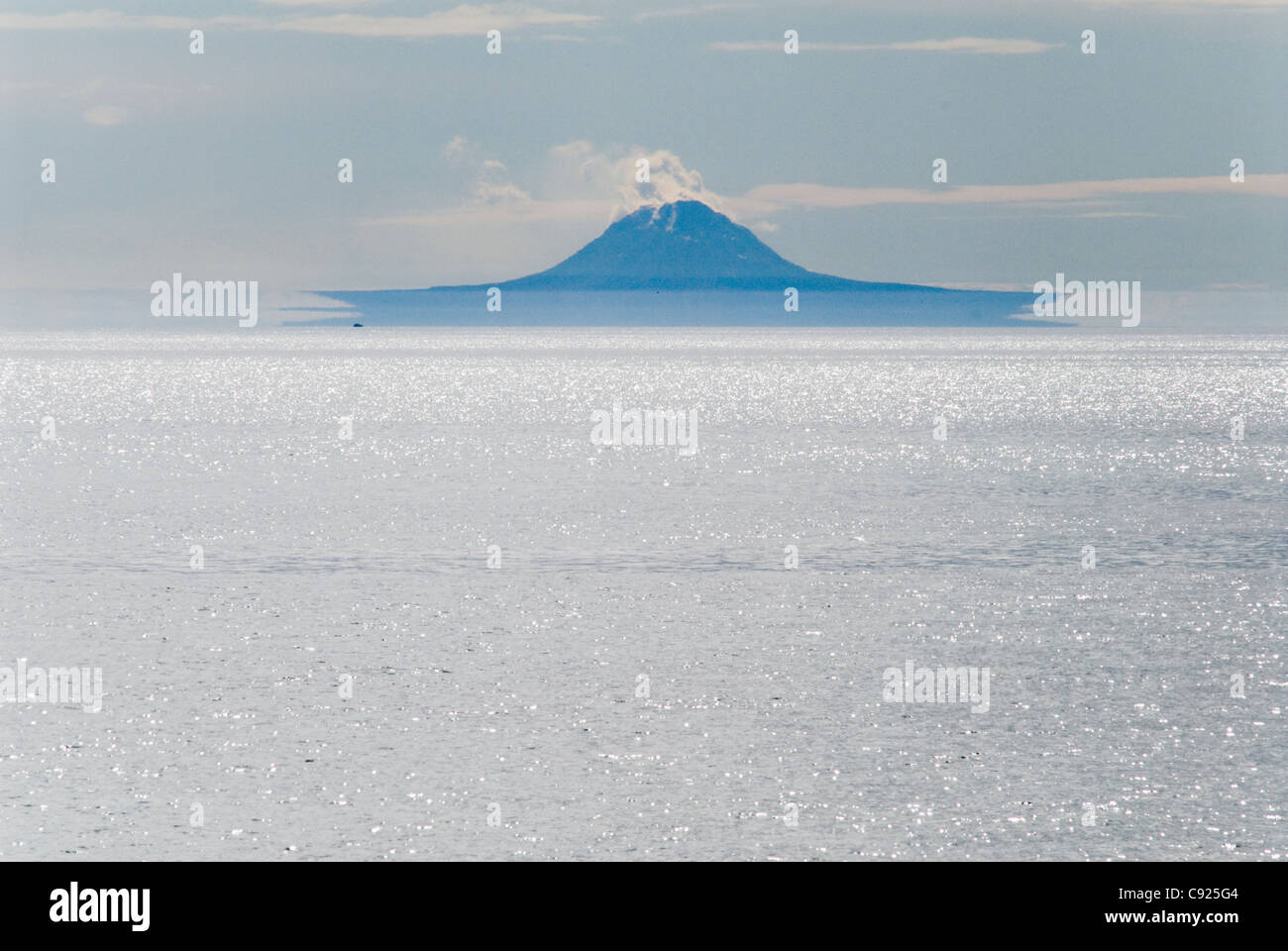 Distant view of Mt. Augustine Volcano in lower Cook Inlet steaming ...