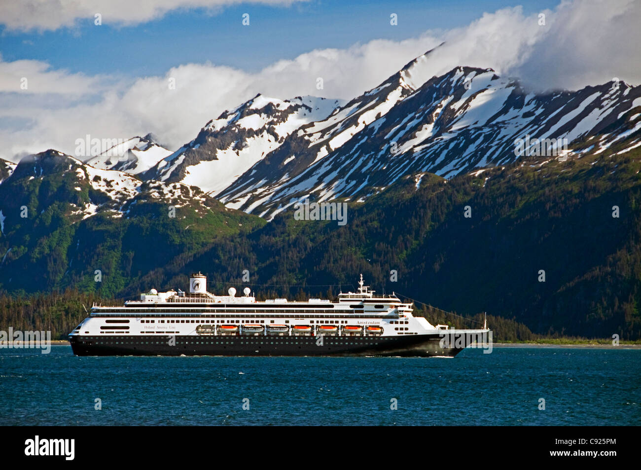 A cruise ship travels Kachemak Bay leaving port on the Homer Spit ...