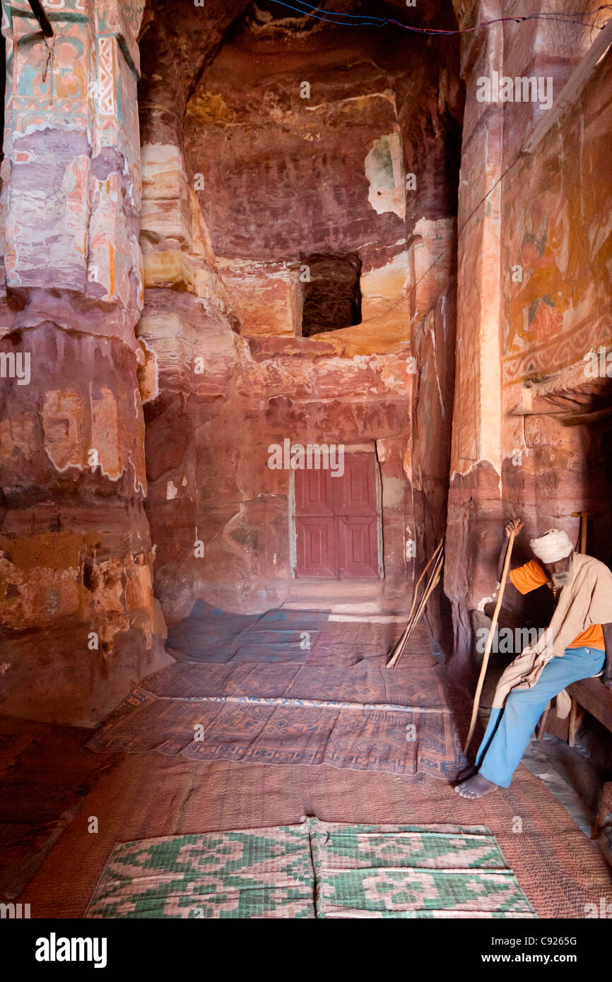 The elderly church guardian resting inside the rock-hewn church of ...