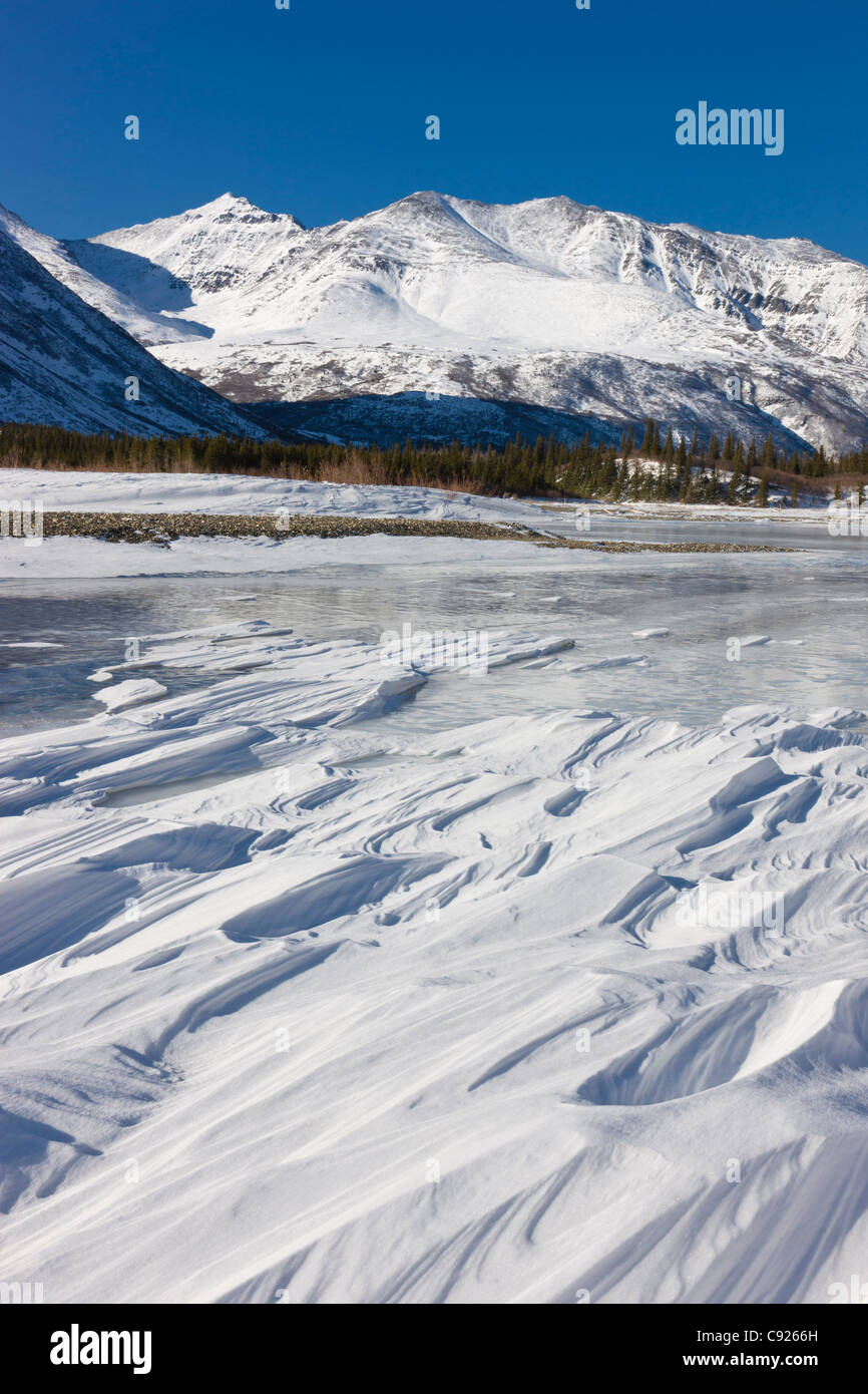 Winter landscape with Sastrugi, wind carved ridges in the snow, along ...