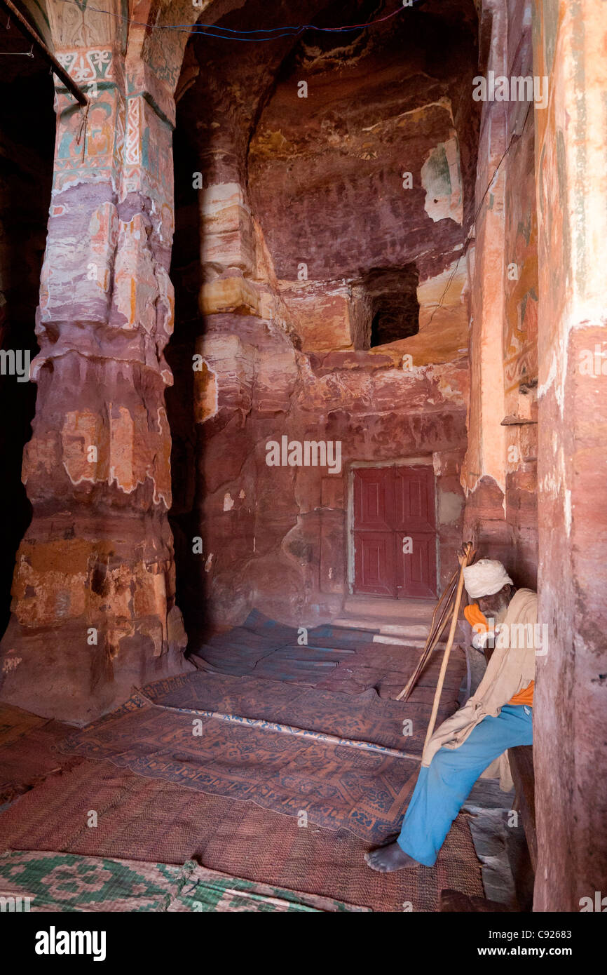 The elderly church guardian resting inside the rock-hewn church of ...