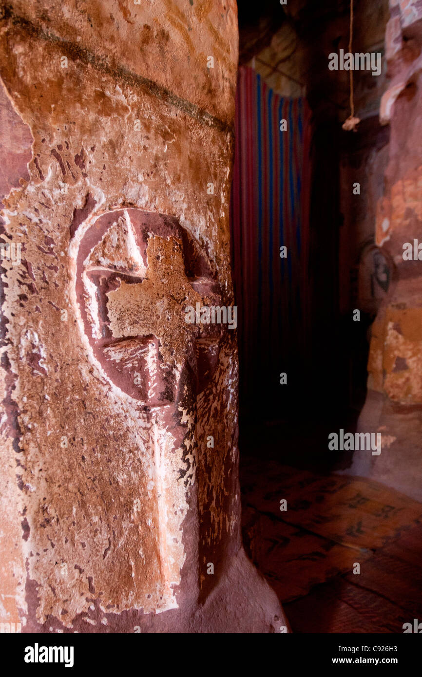 Carved stone cross inside the rock-hewn church of Debre Tsion Abraham ...