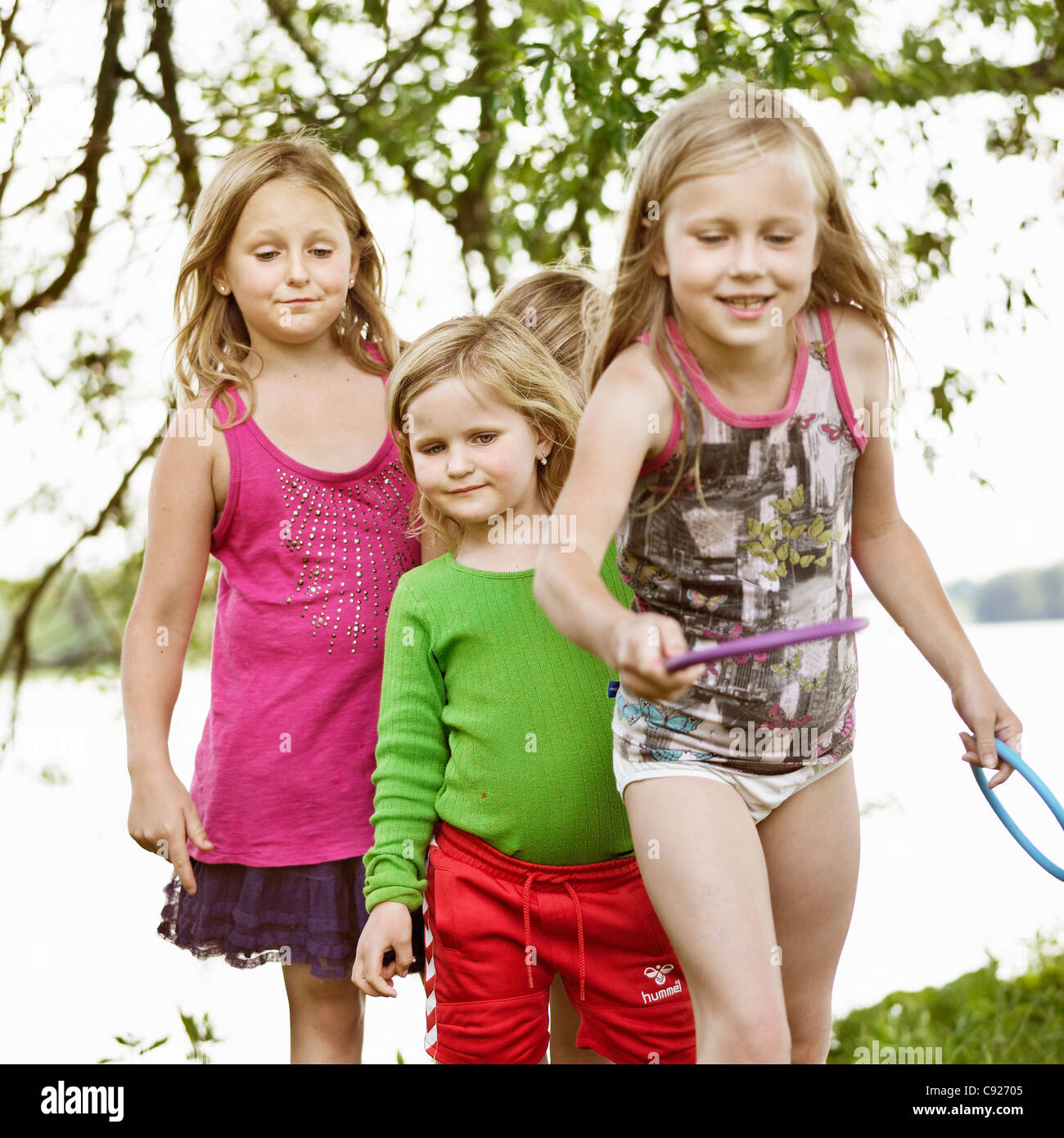 Girls playing with rings together Stock Photo - Alamy