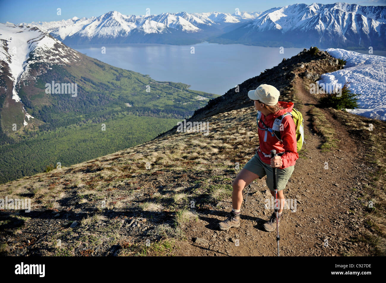 Woman hikes up the Bird Ridge Trail in Chugach State Park with the ...