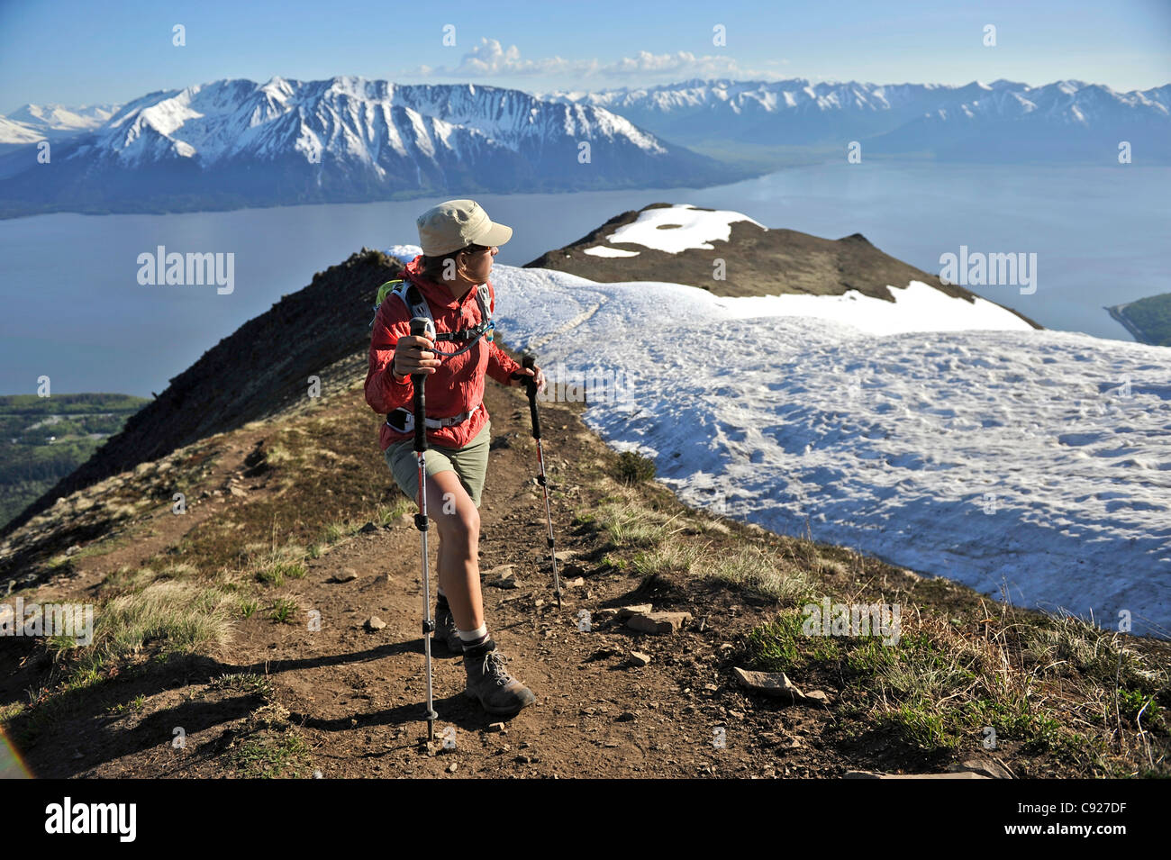 Woman hikes up the Bird Ridge Trail in Chugach State Park with the ...