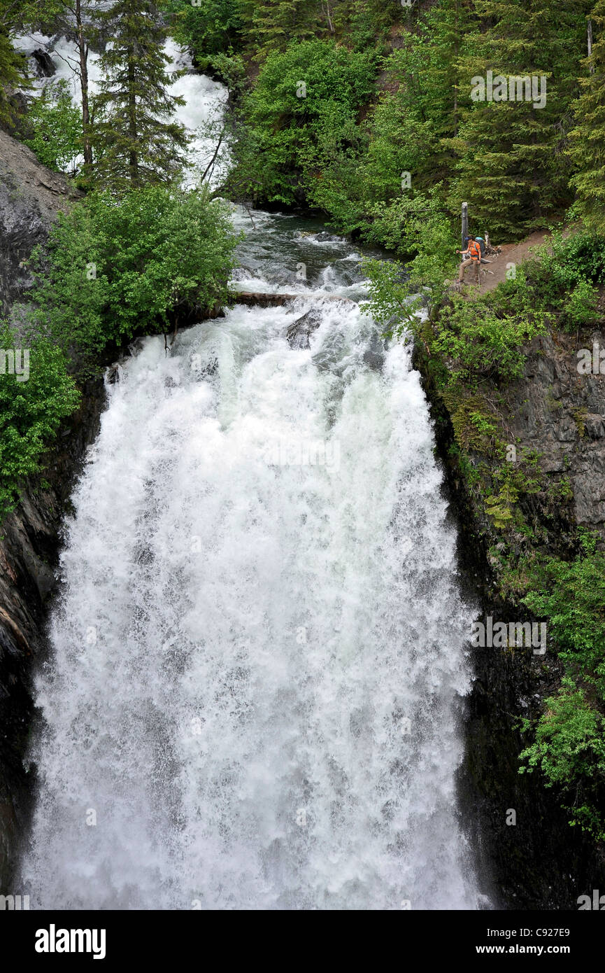 Woman hikes near Juneau Falls on the Resurrection Pass Trail in the ...