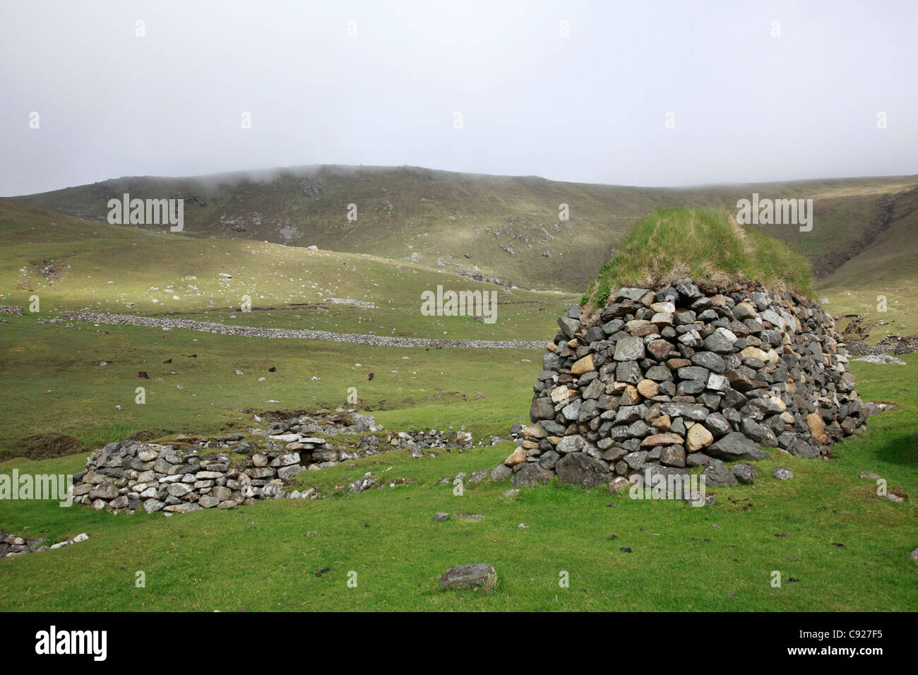 Grass-covered buildings overlooking the bay at St Kilda in the Outer ...