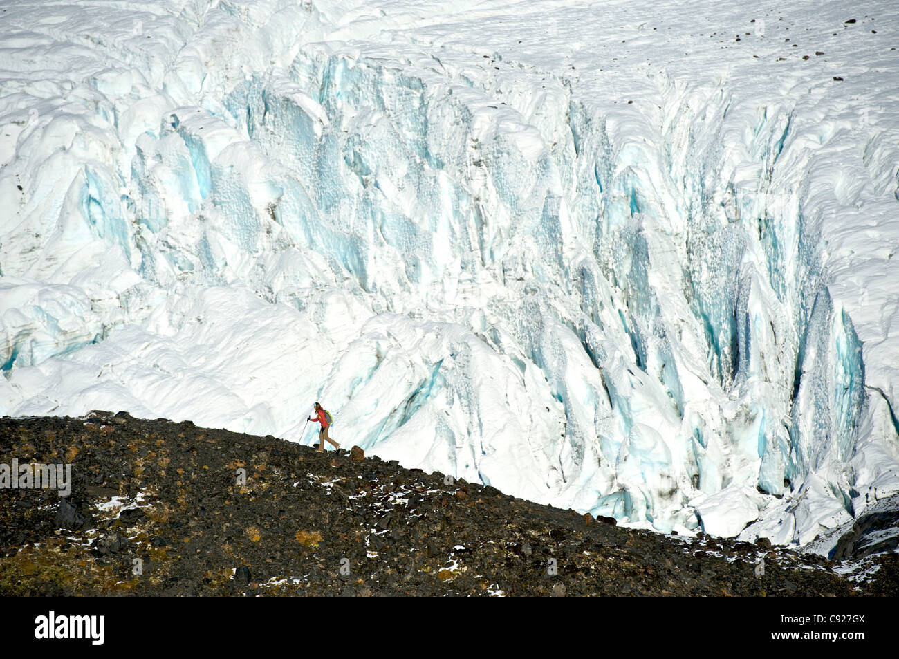 Woman hiking on the Crow Pass Trail in front of Raven Glacier, Chugach ...