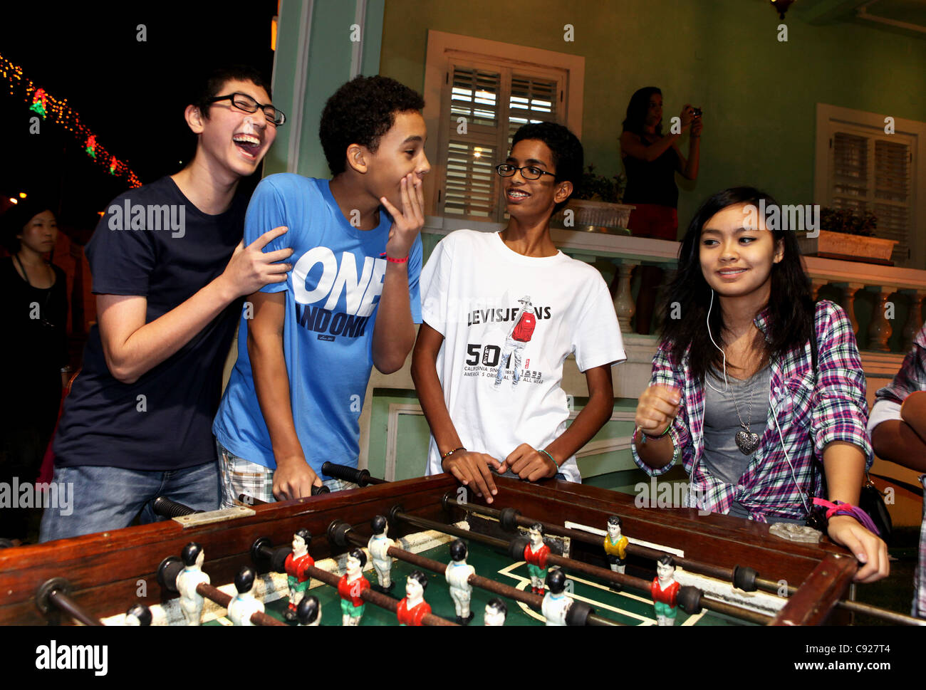 Kids playing table football, foosball, Lusofonia Festival, Macau Stock ...