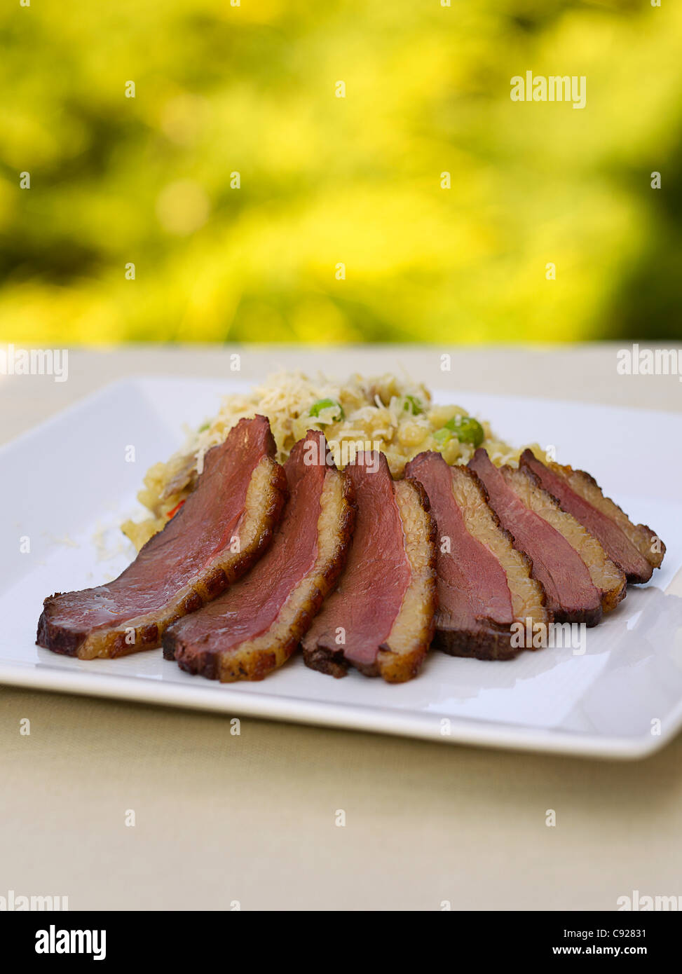 Duck fillets with rice Stock Photo - Alamy