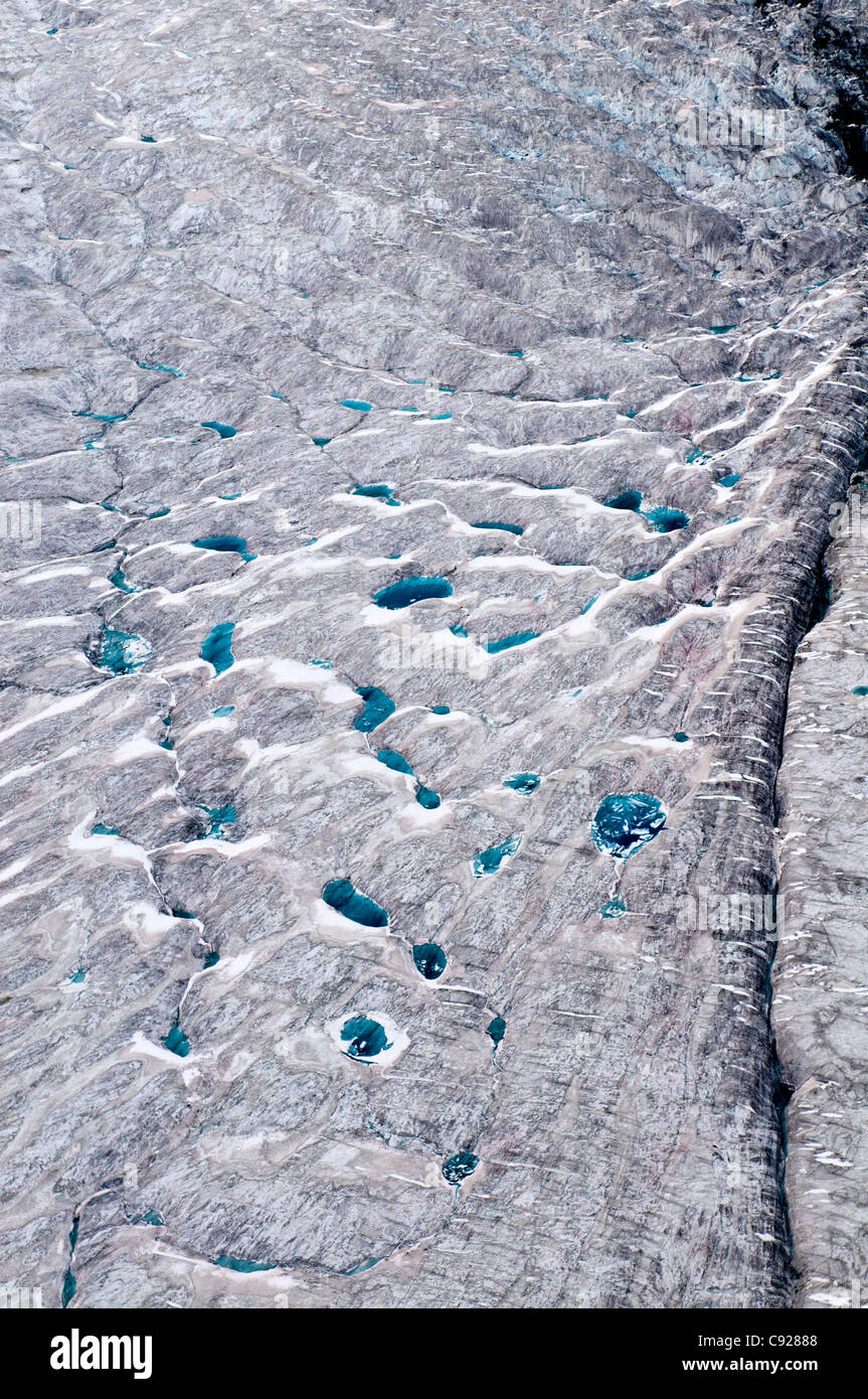 Aerial view of blue water pools on Ruth Glacier in Denali National Park ...