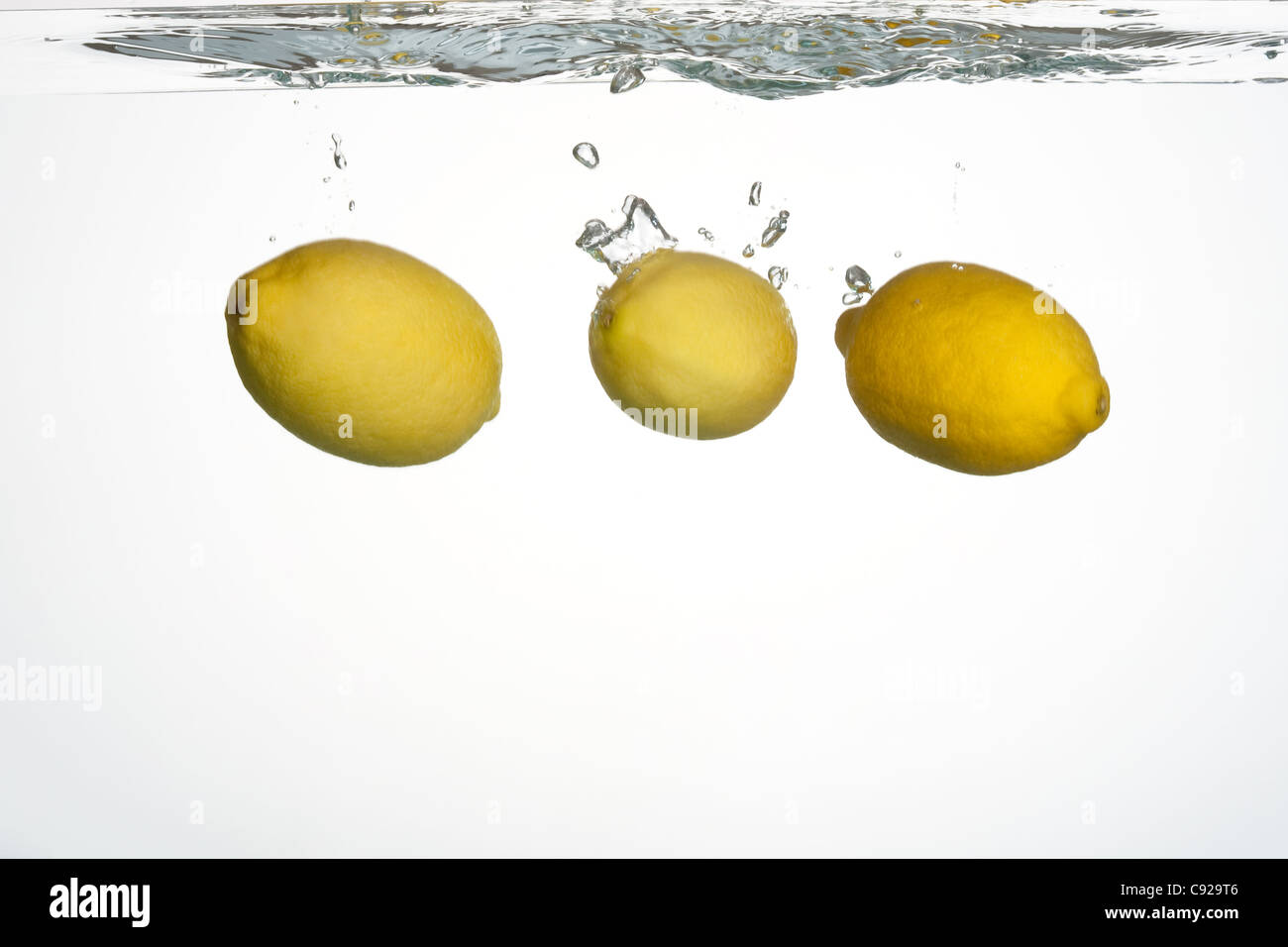 Lemons splashing in water Stock Photo - Alamy