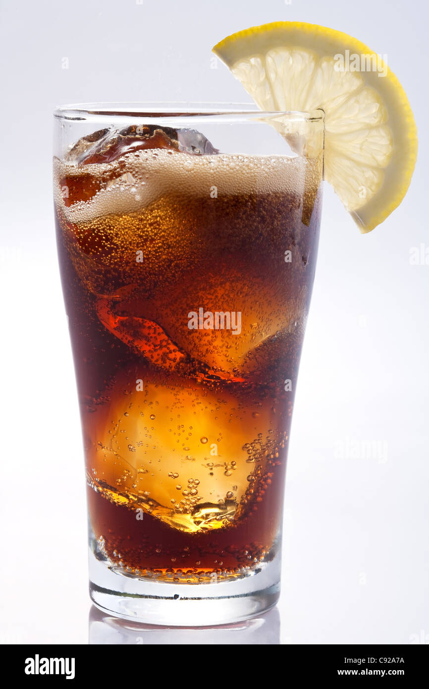 Glass of iced cola with a lemon slice Stock Photo - Alamy