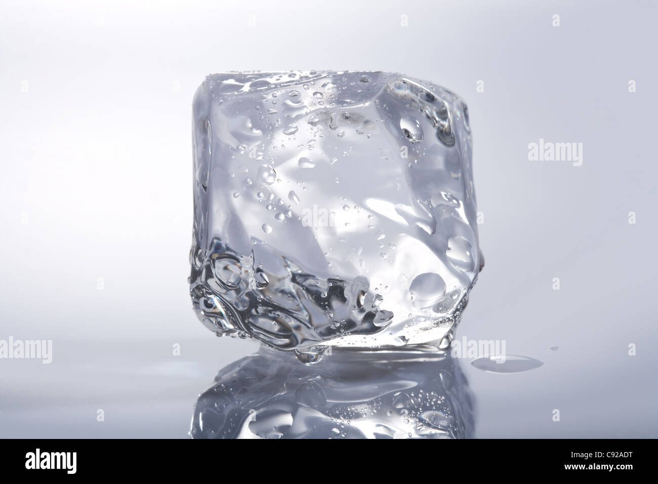 Melting ice cube Stock Photo - Alamy