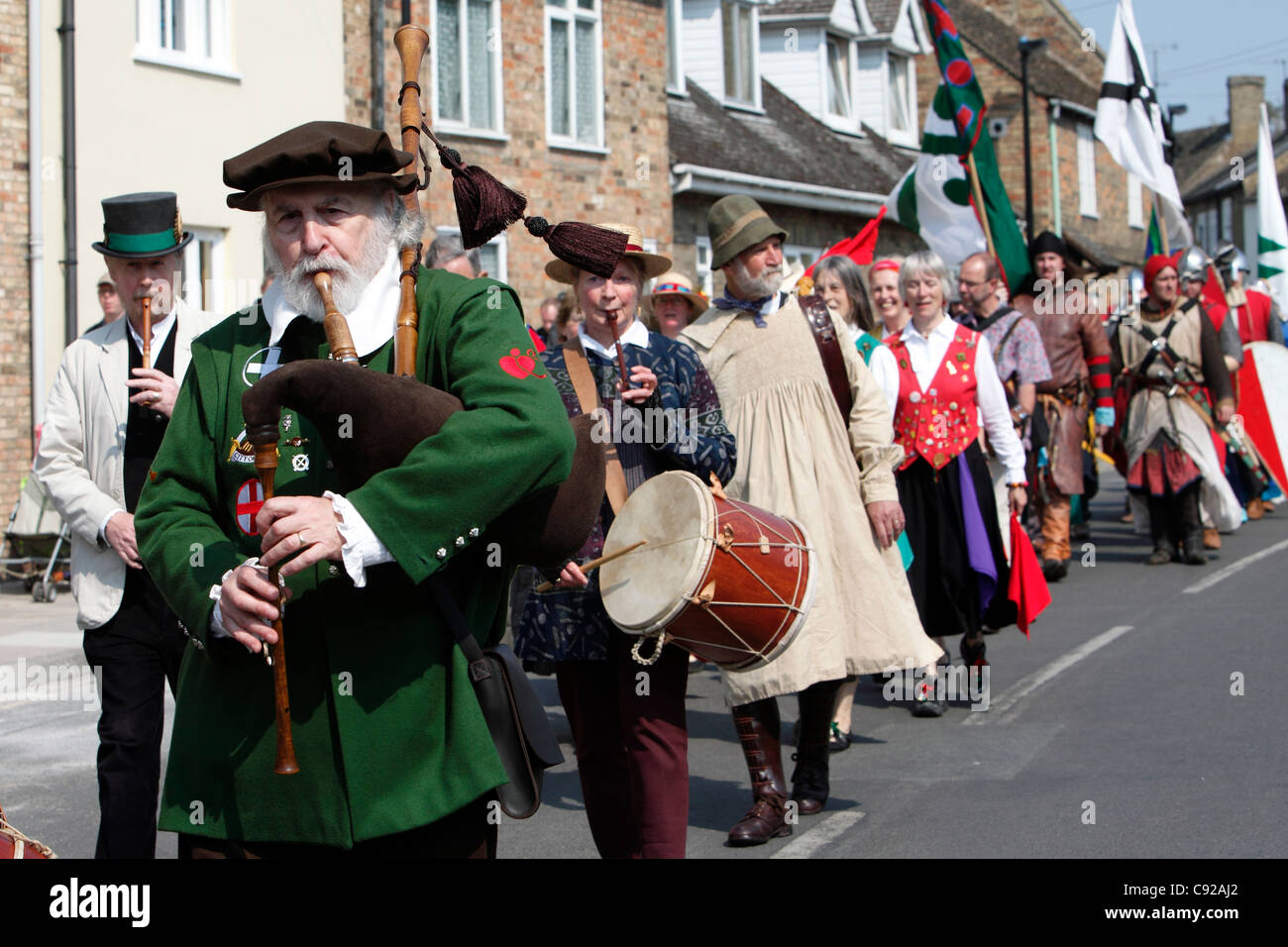 local residents parade through the city at the start of Ely's Eel day ...