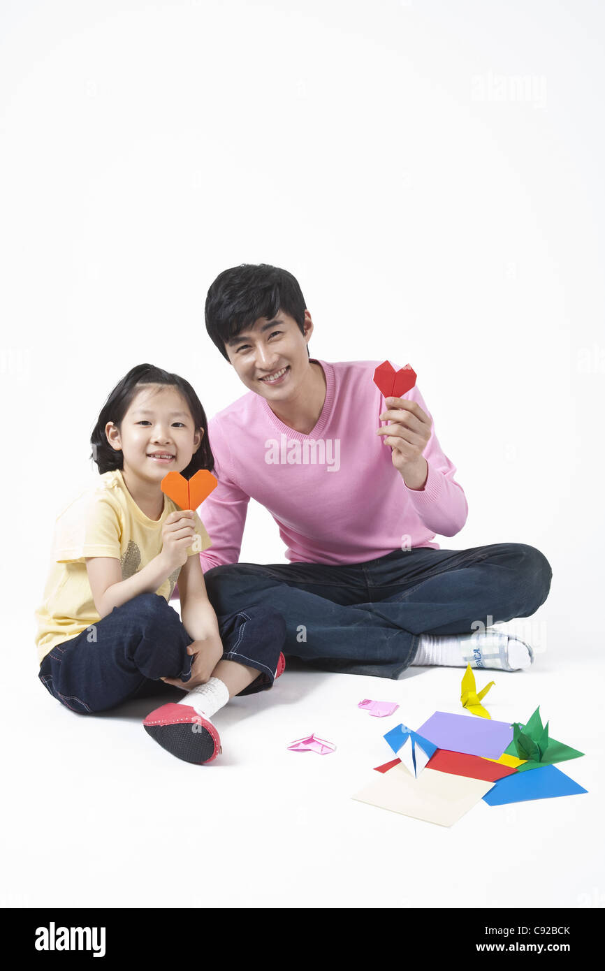 Father and daughter making craft product in studio Stock Photo - Alamy