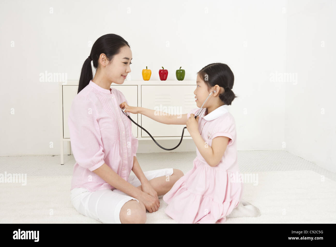 Woman girl playing stethoscope hi-res stock photography and images - Alamy