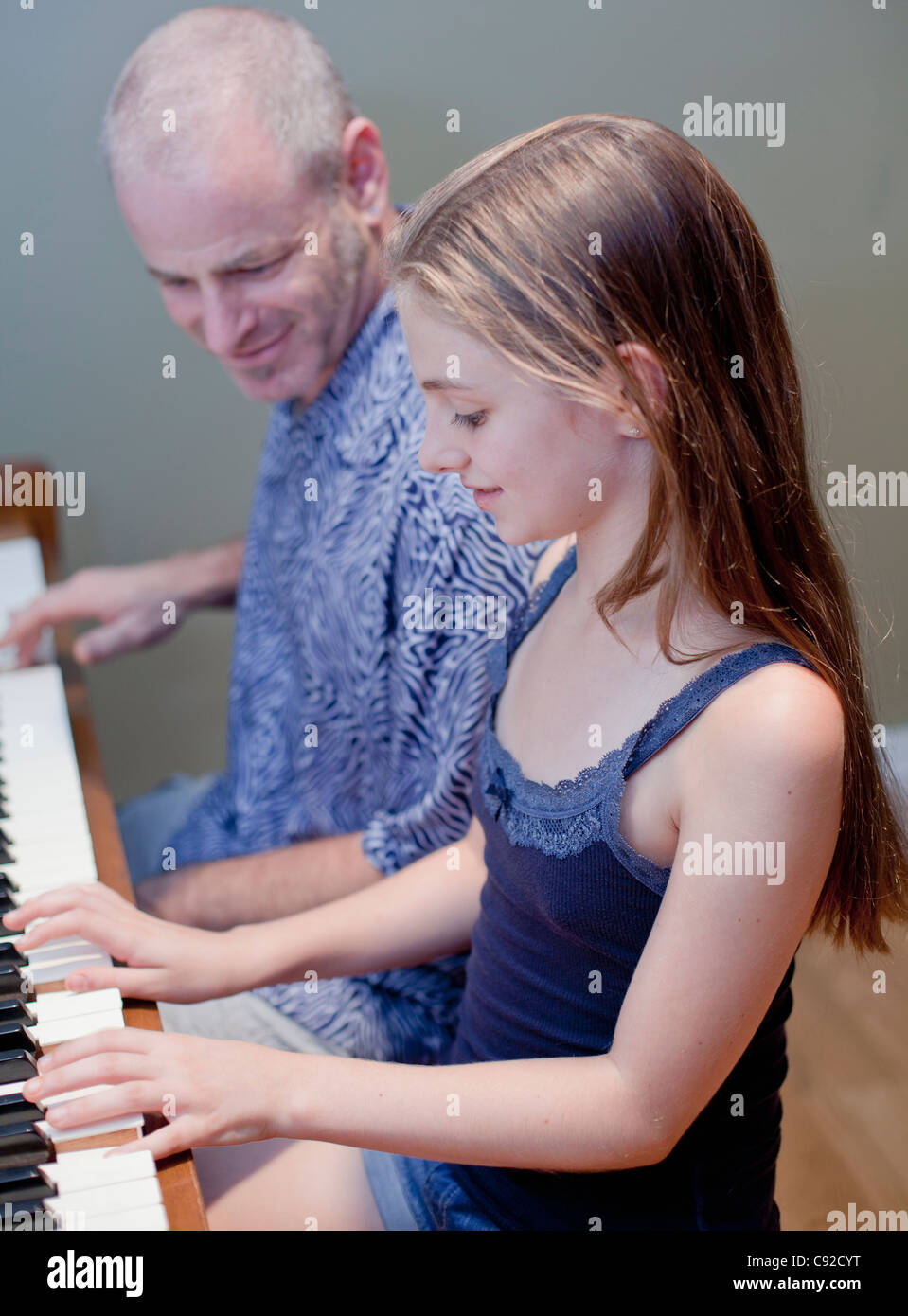 Father and daughter playing piano Stock Photo - Alamy