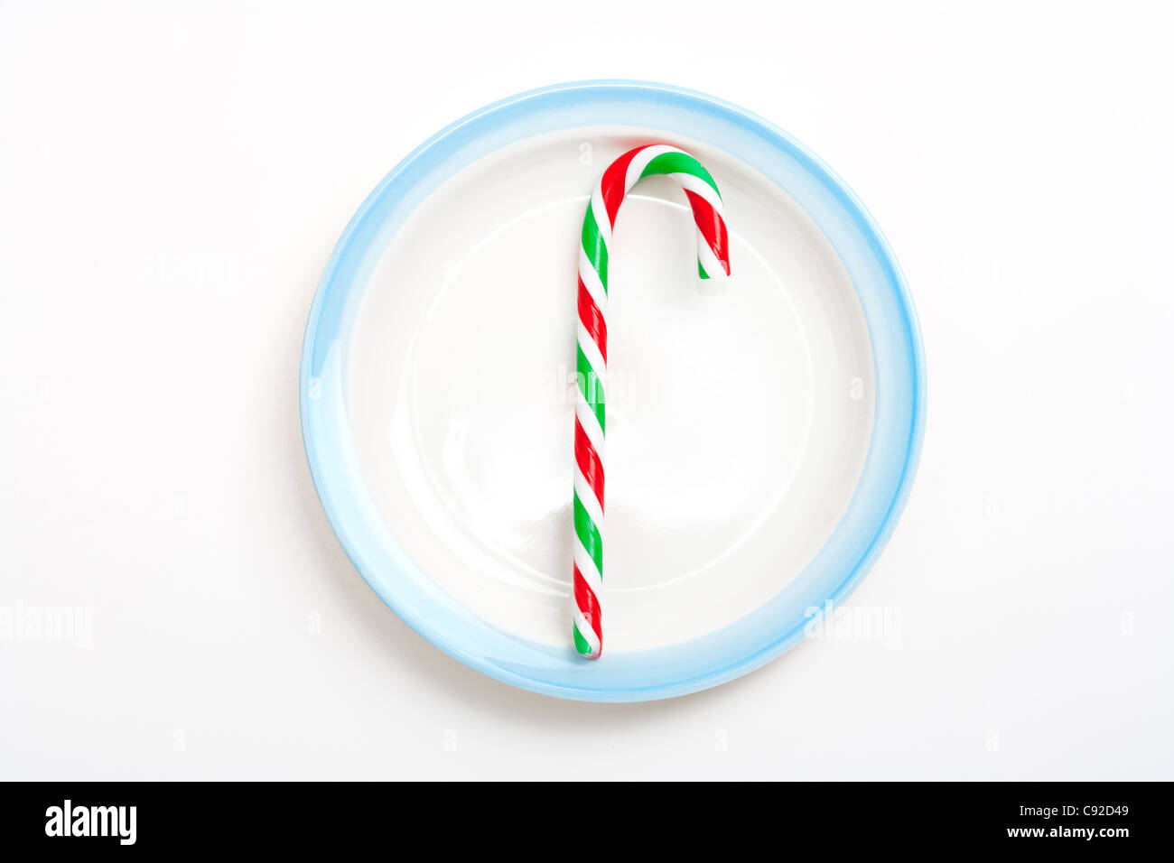 A candy cane in plate Stock Photo - Alamy