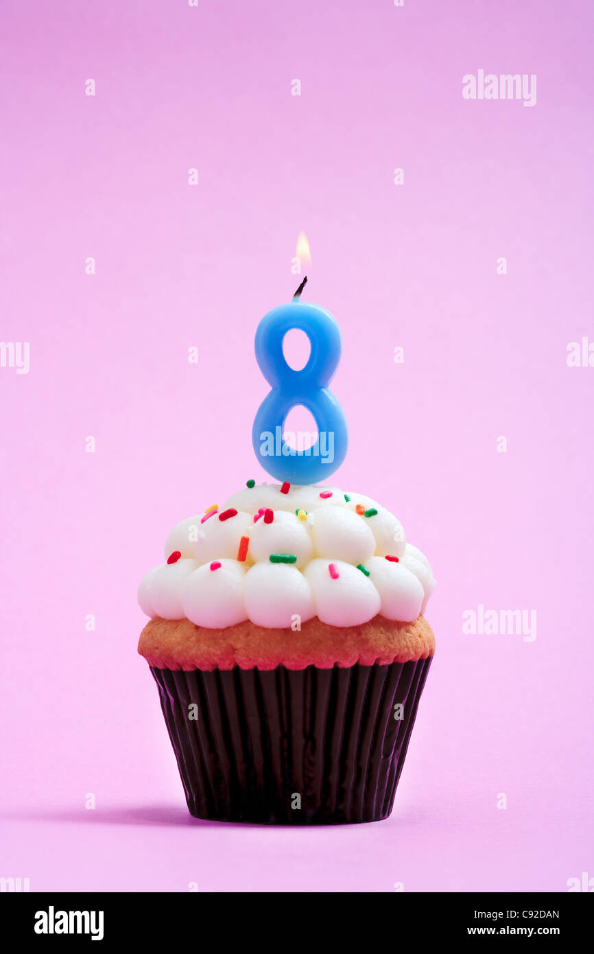 Birthday cupcake with number 8 candle Stock Photo - Alamy